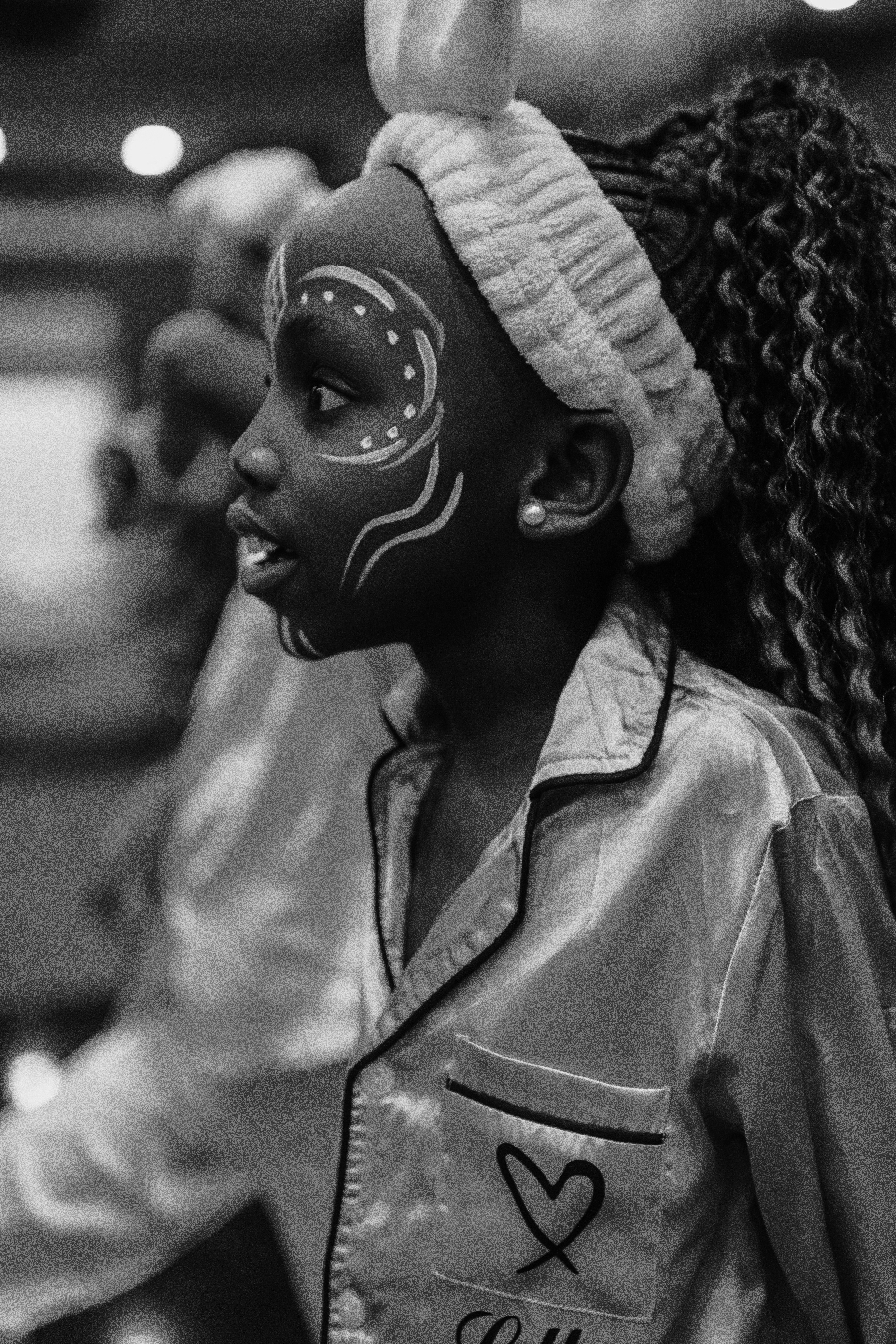 Circus of Circles: A Young Performer in a Monochrome Moment
