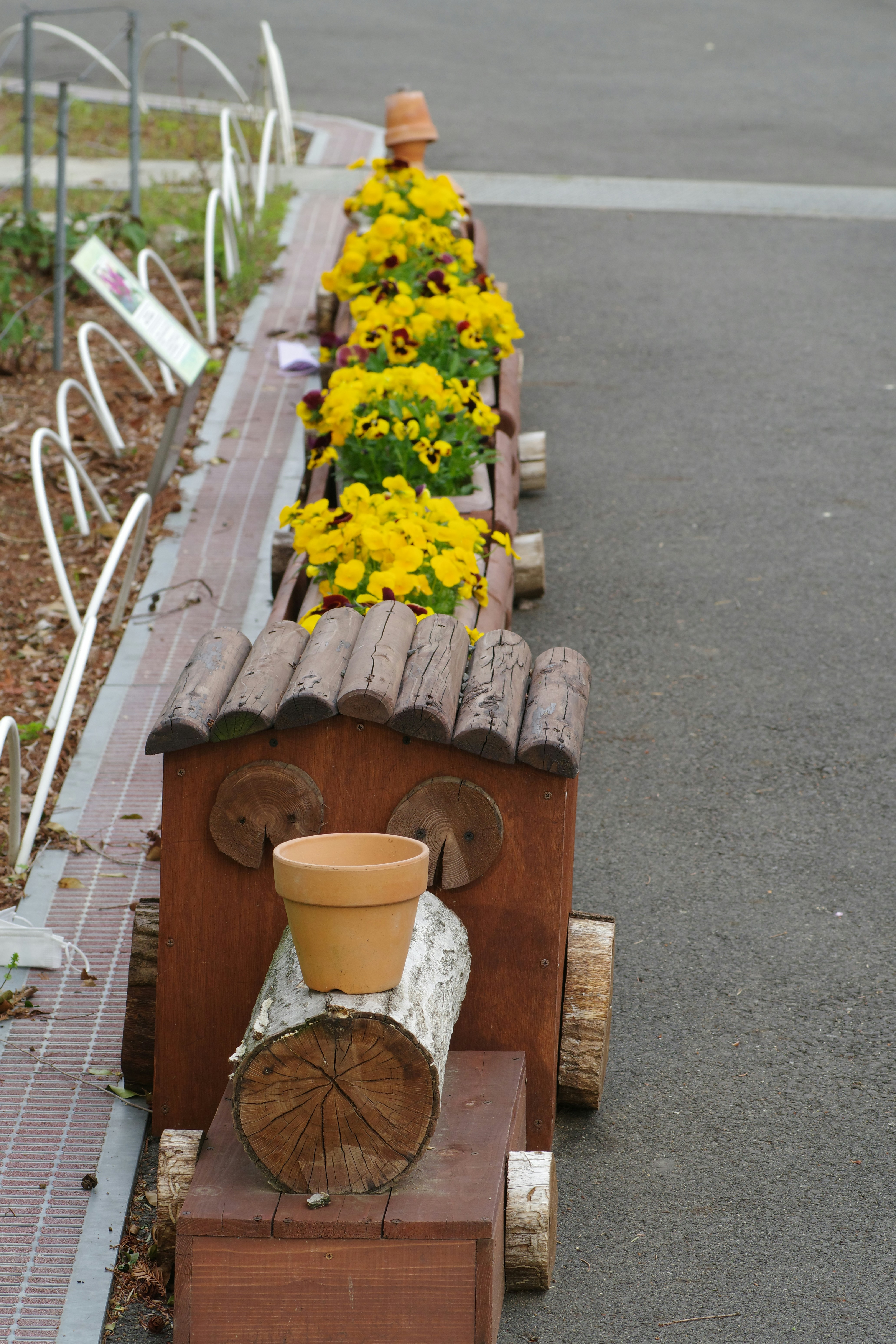 A wooden train planter with yellow flowers. photo – Free Flower Image ...