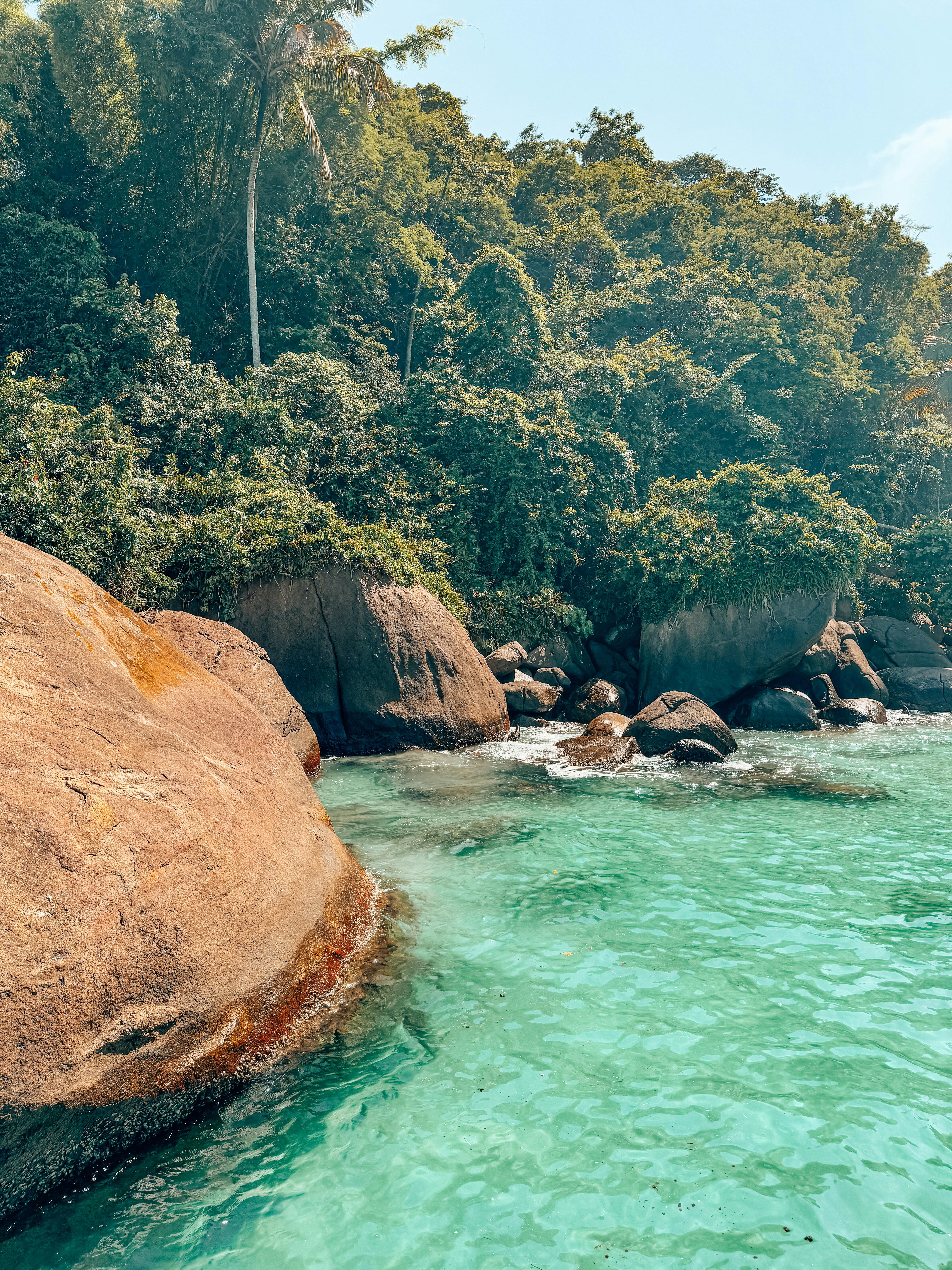 Emerald Tide Along Sun-Kissed Granite Shore
