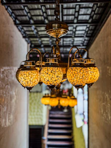 Amber Mosaic Pendant Lamps Illuminate a Narrow Stairwell