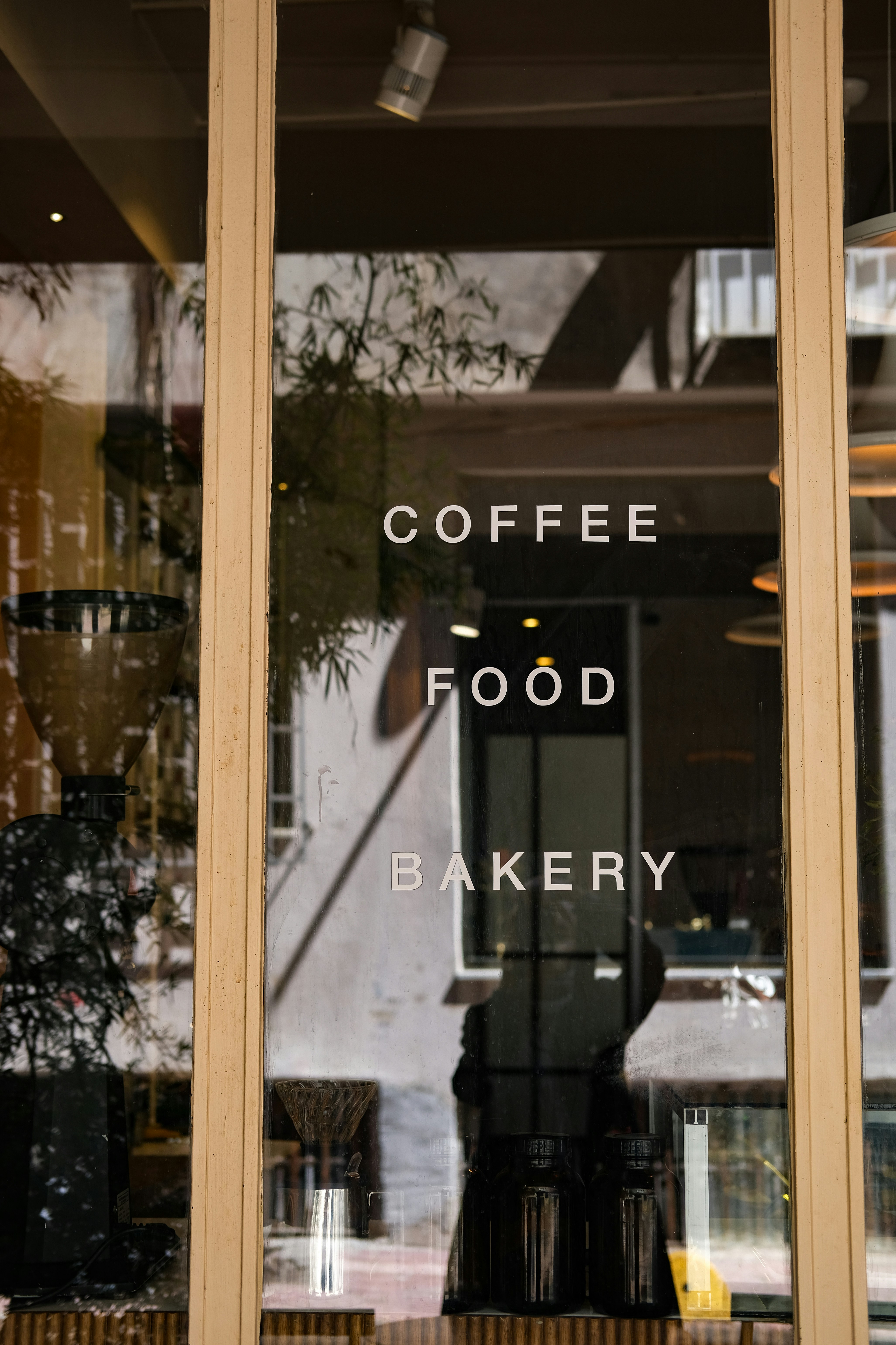 Cafe window offers coffee, food, and bakery items. photo – Free Shop ...