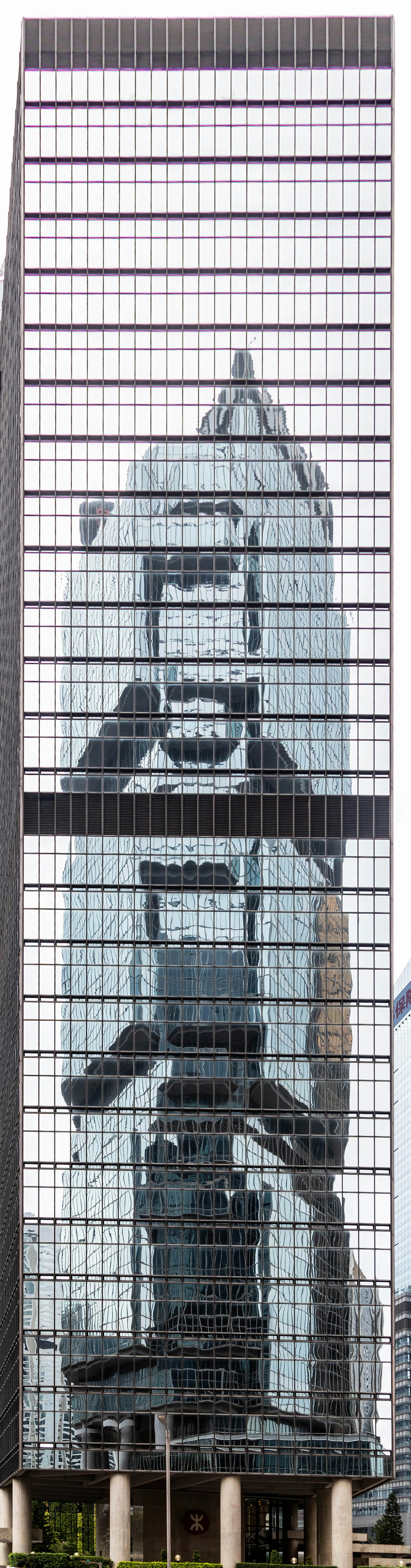 Gridbound Glass: The Tower’s Facade Unfolds in a Web of Windows