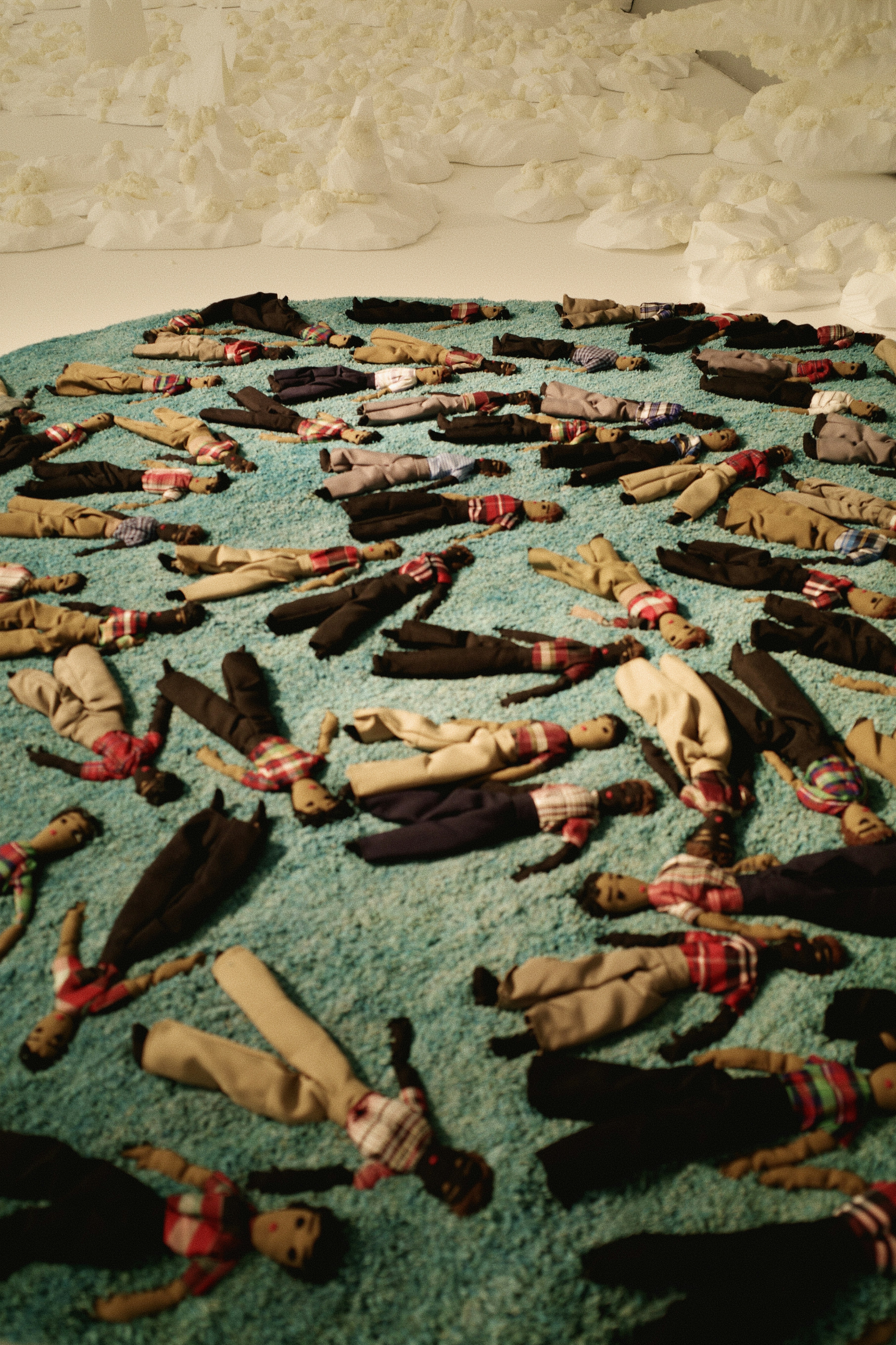 Floating Figures on a Turquoise Carpet: A Sea of Dressed Dummies