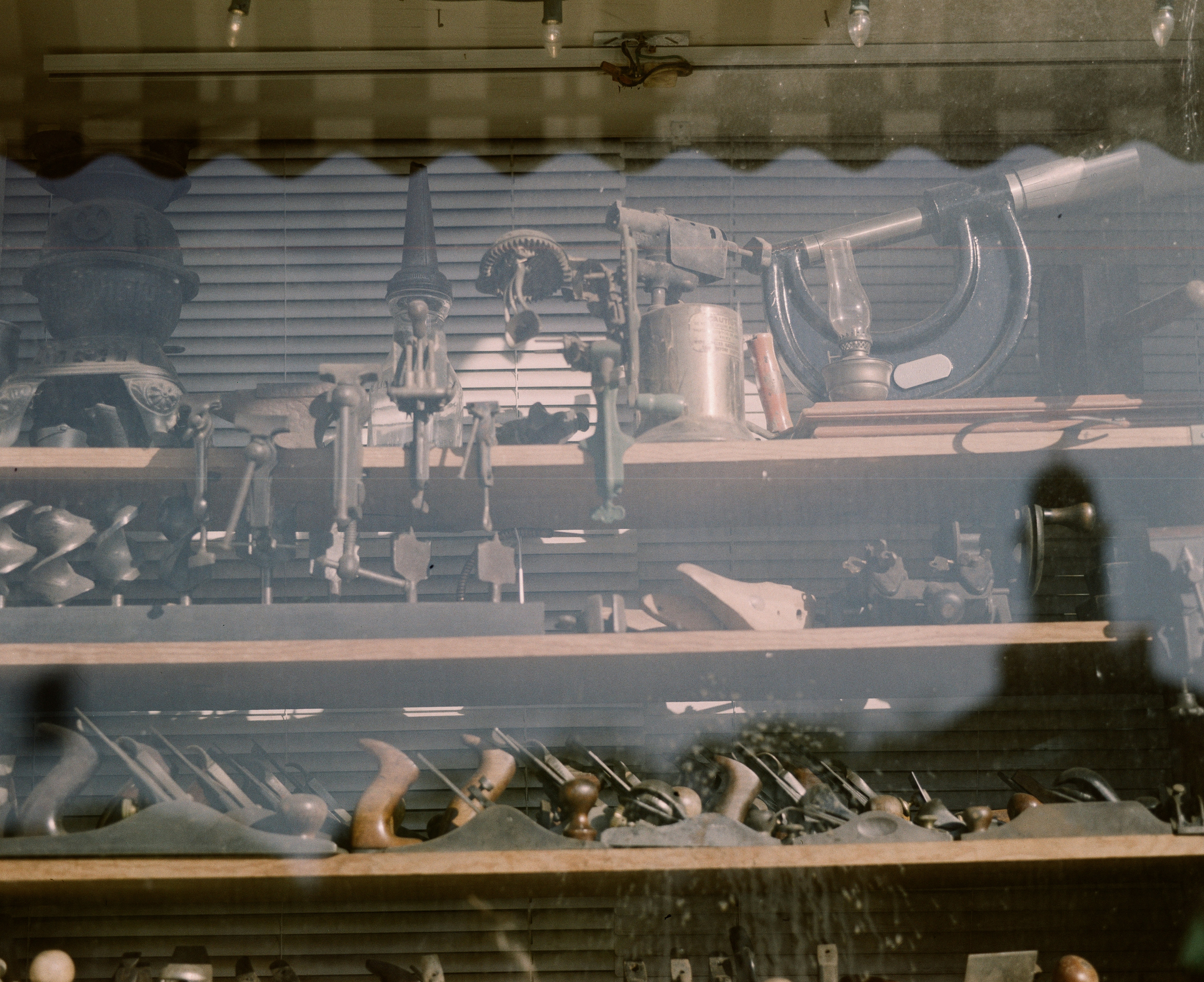 A workbench filled with a variety of tools. photo – Free Gun Image on ...