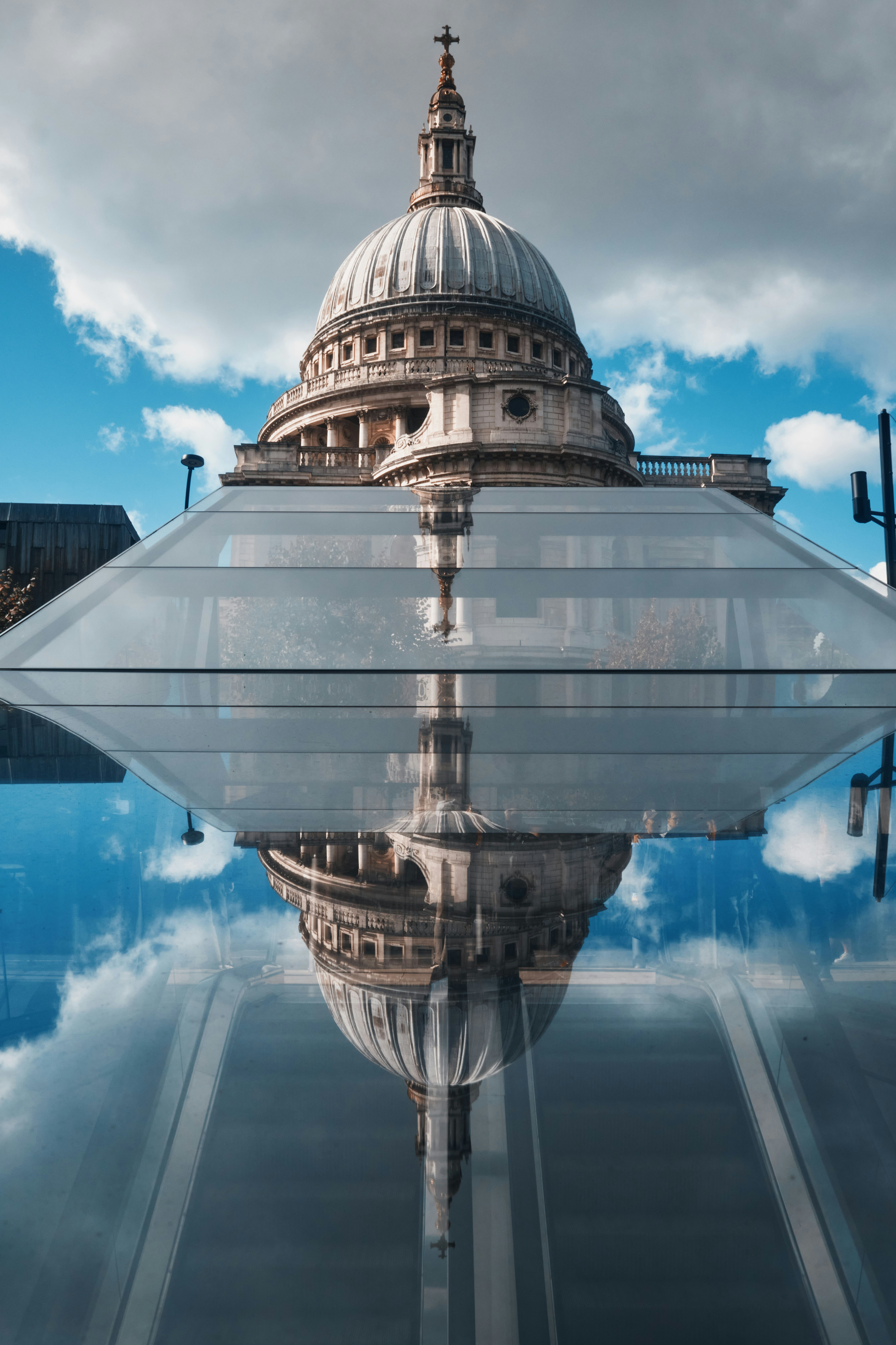 Dome Reflection: Glass-Plane Panorama of Stone and Sky