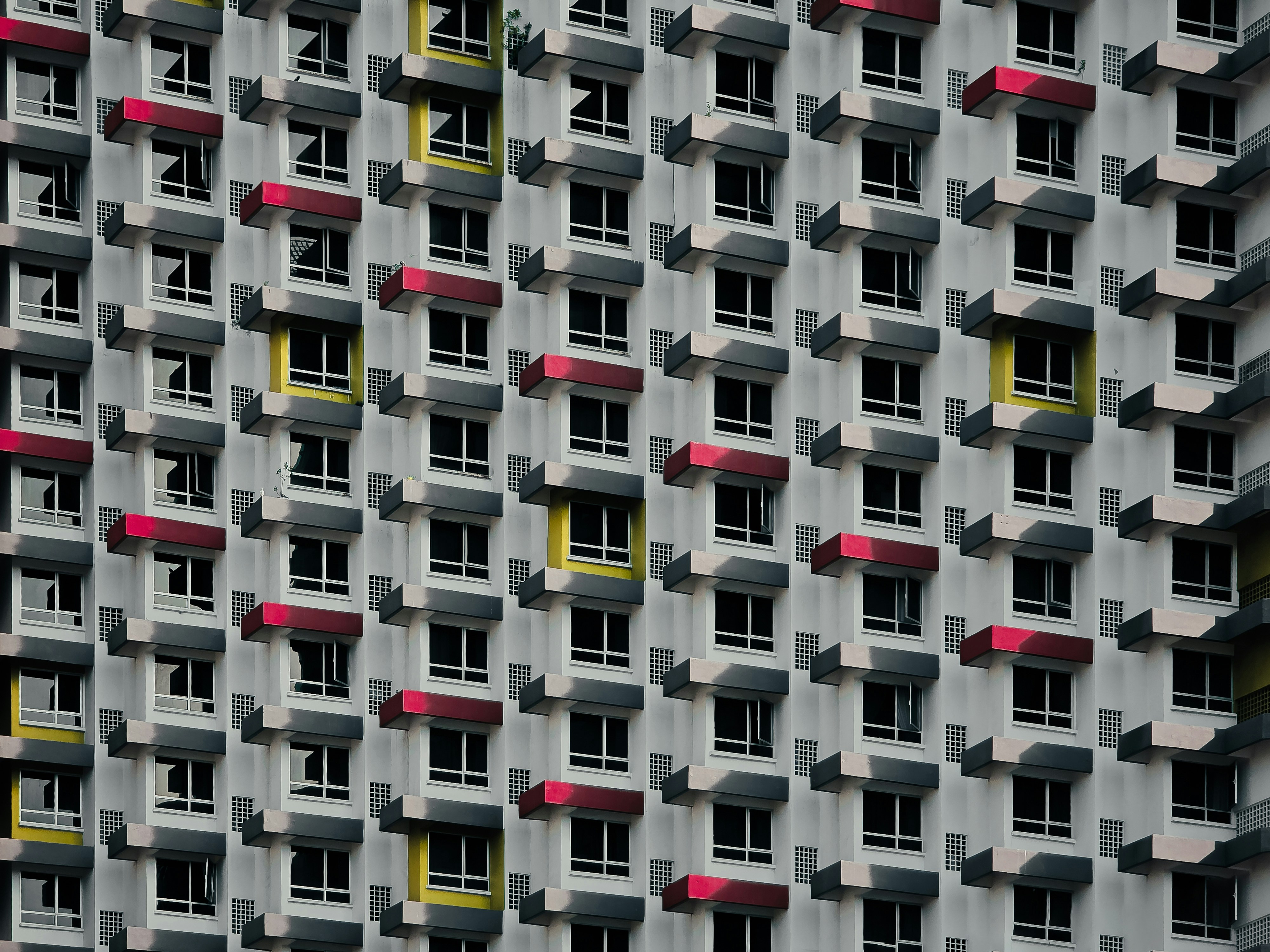 An apartment building with many repeating windows. photo – Free Texture ...