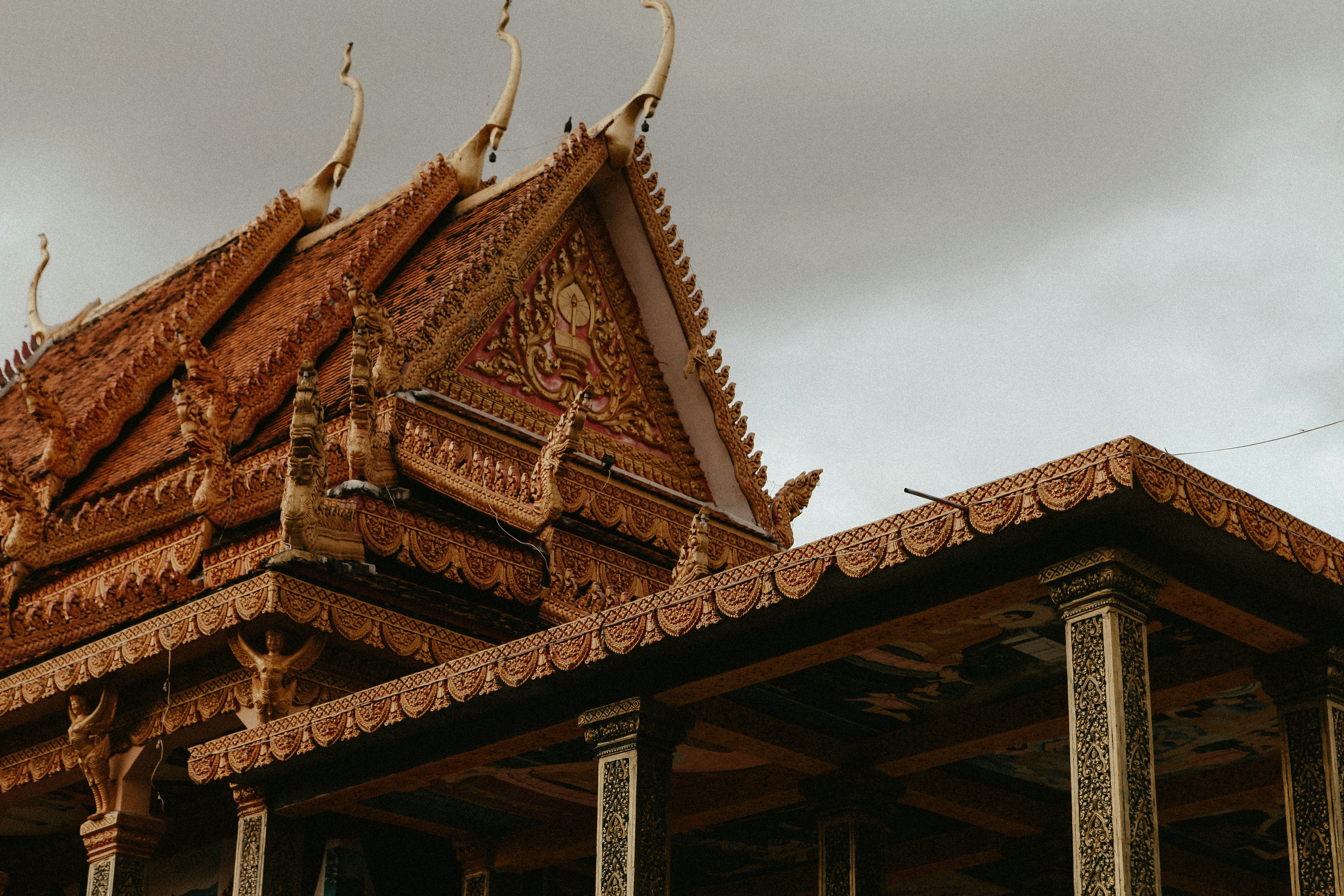 A beautiful, ornate temple under a gray sky. photo – Free Building ...