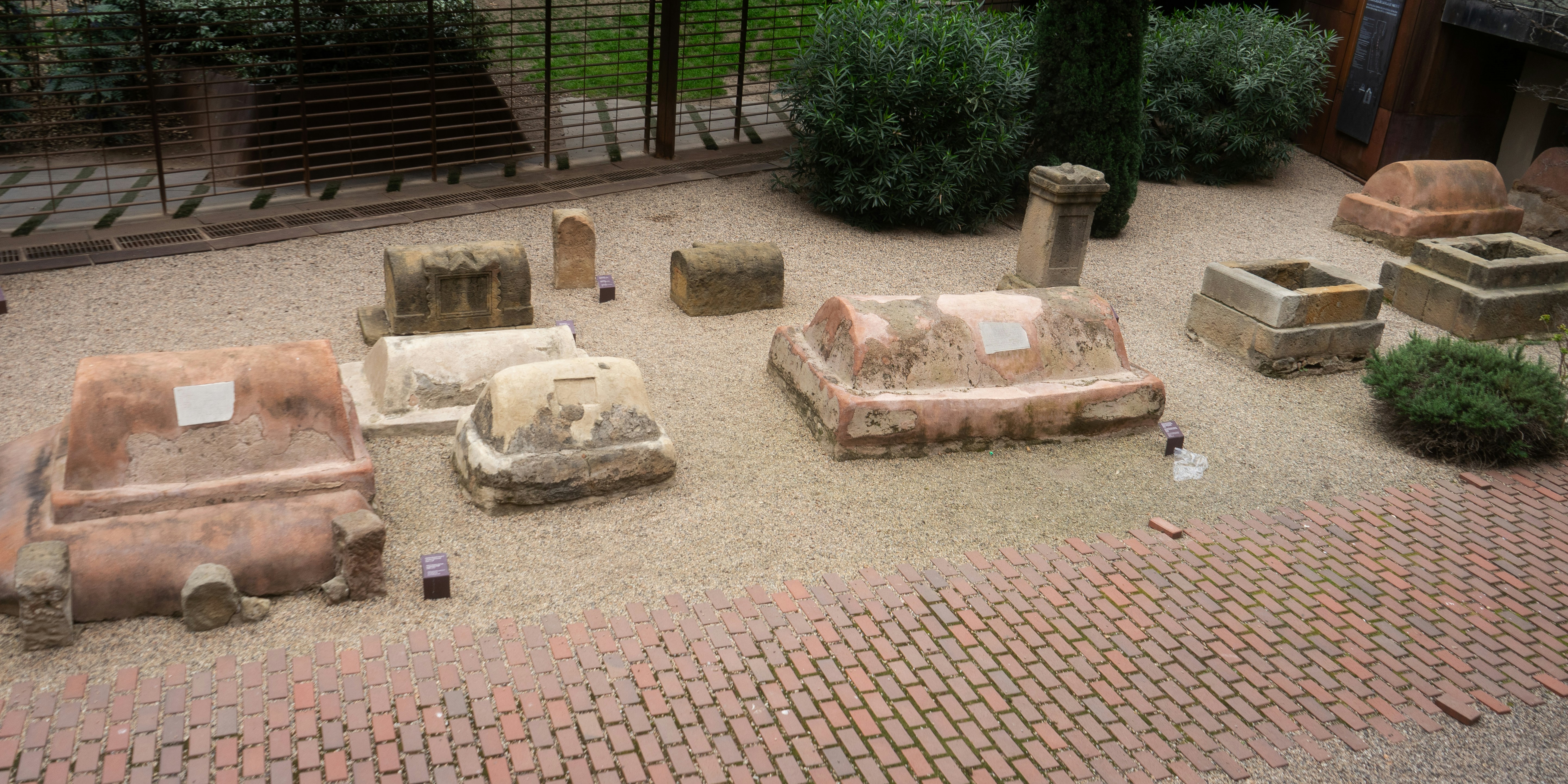 Gravel Courtyard Stone Relics: Weathered Monoliths in a Quiet Outdoor Gallery