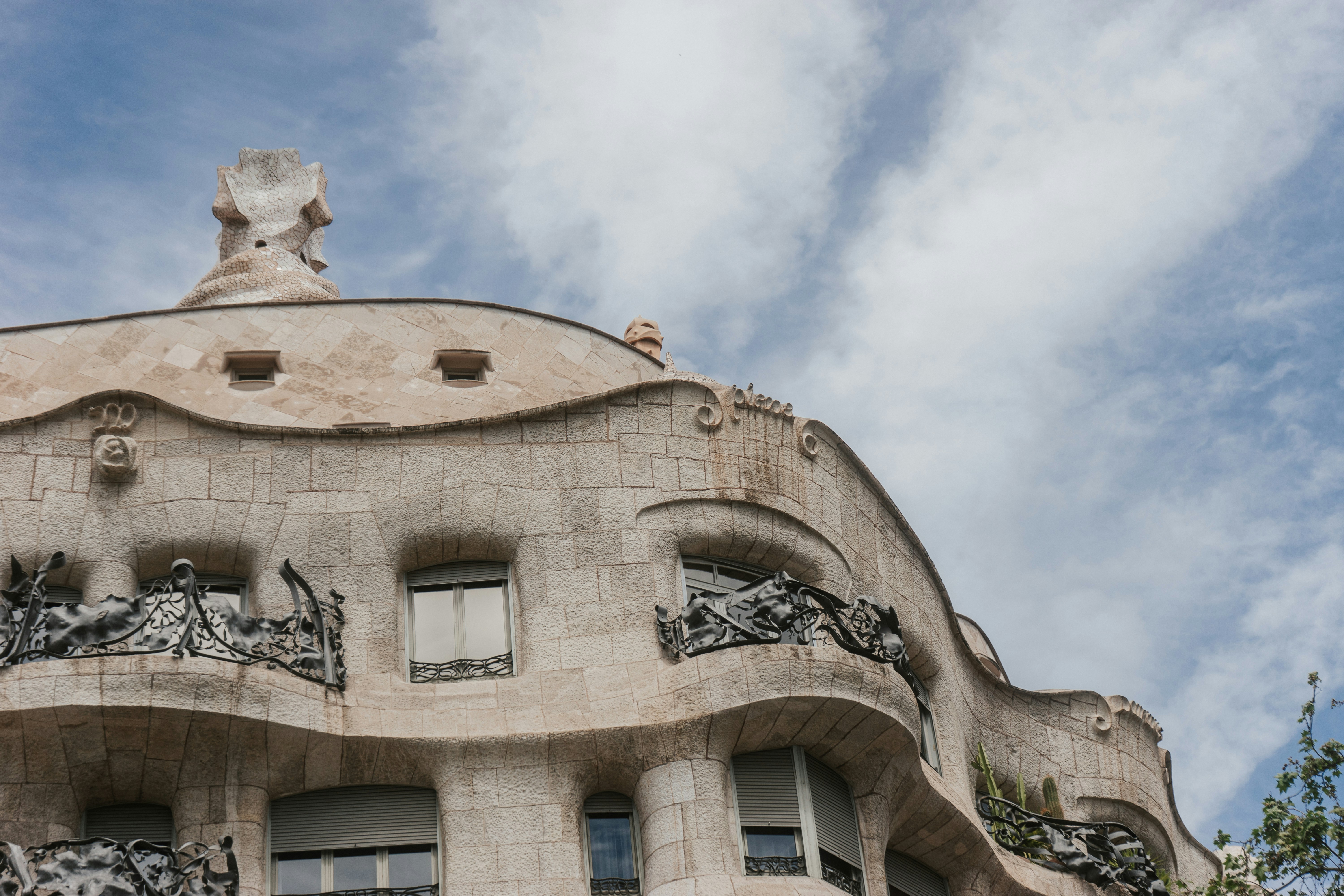 Stone Waves of La Pedrera: Gaudí's Curved Facade in Barcelona Light