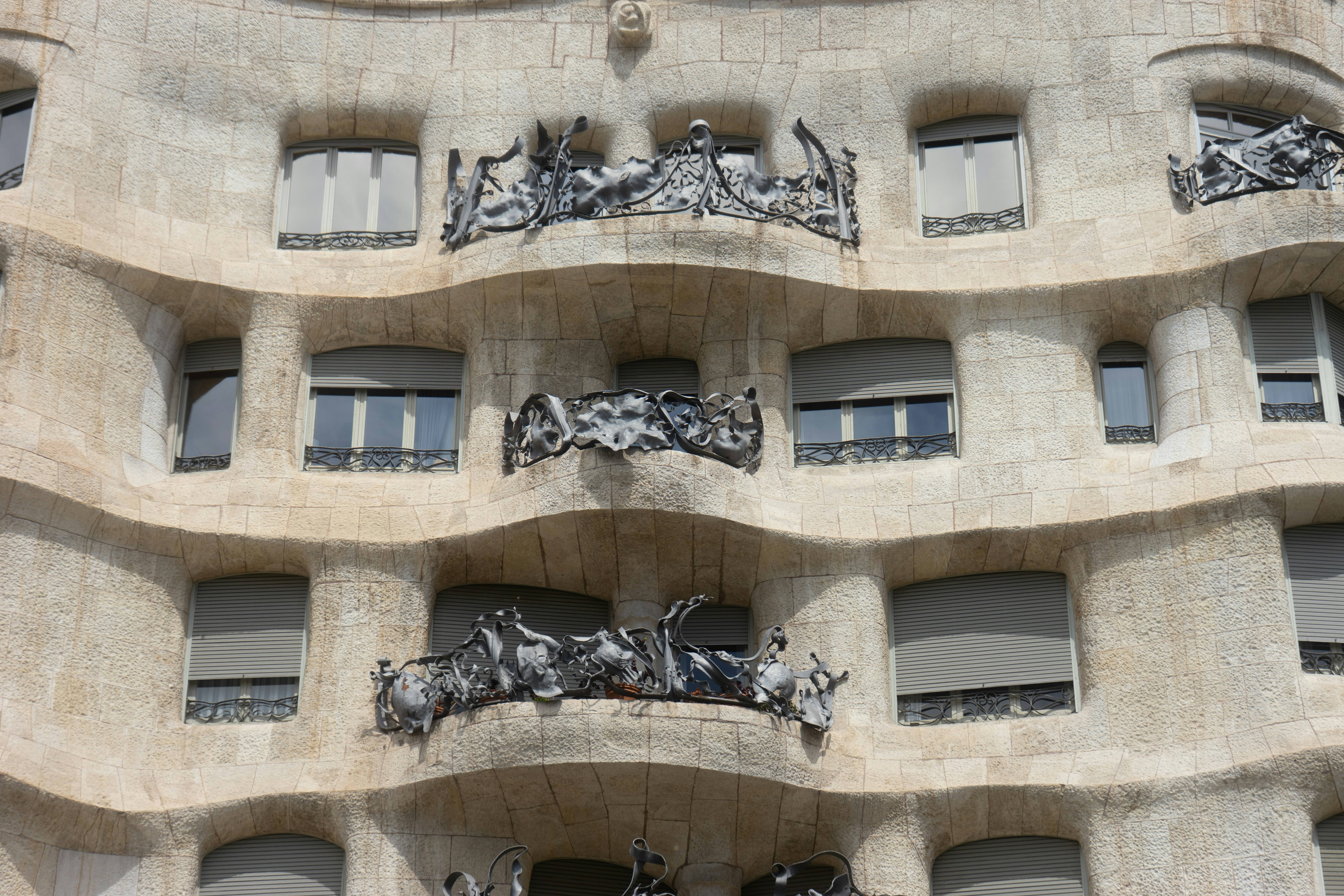 La Pedrera Facade: Undulating Stone and Iron Balconies