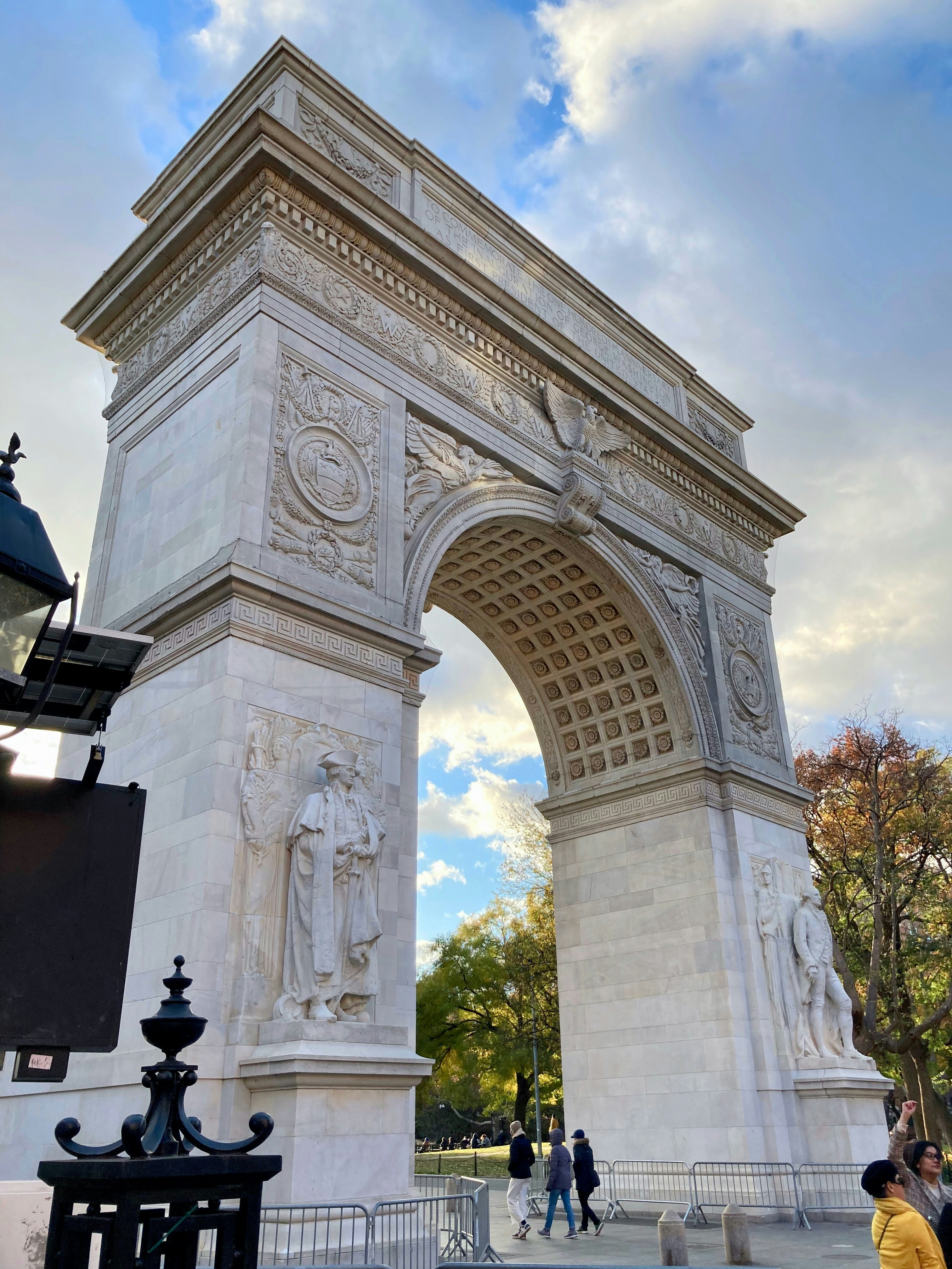 Stone Archway in Plaza: Ornamented Triumph over a Quiet Crowd