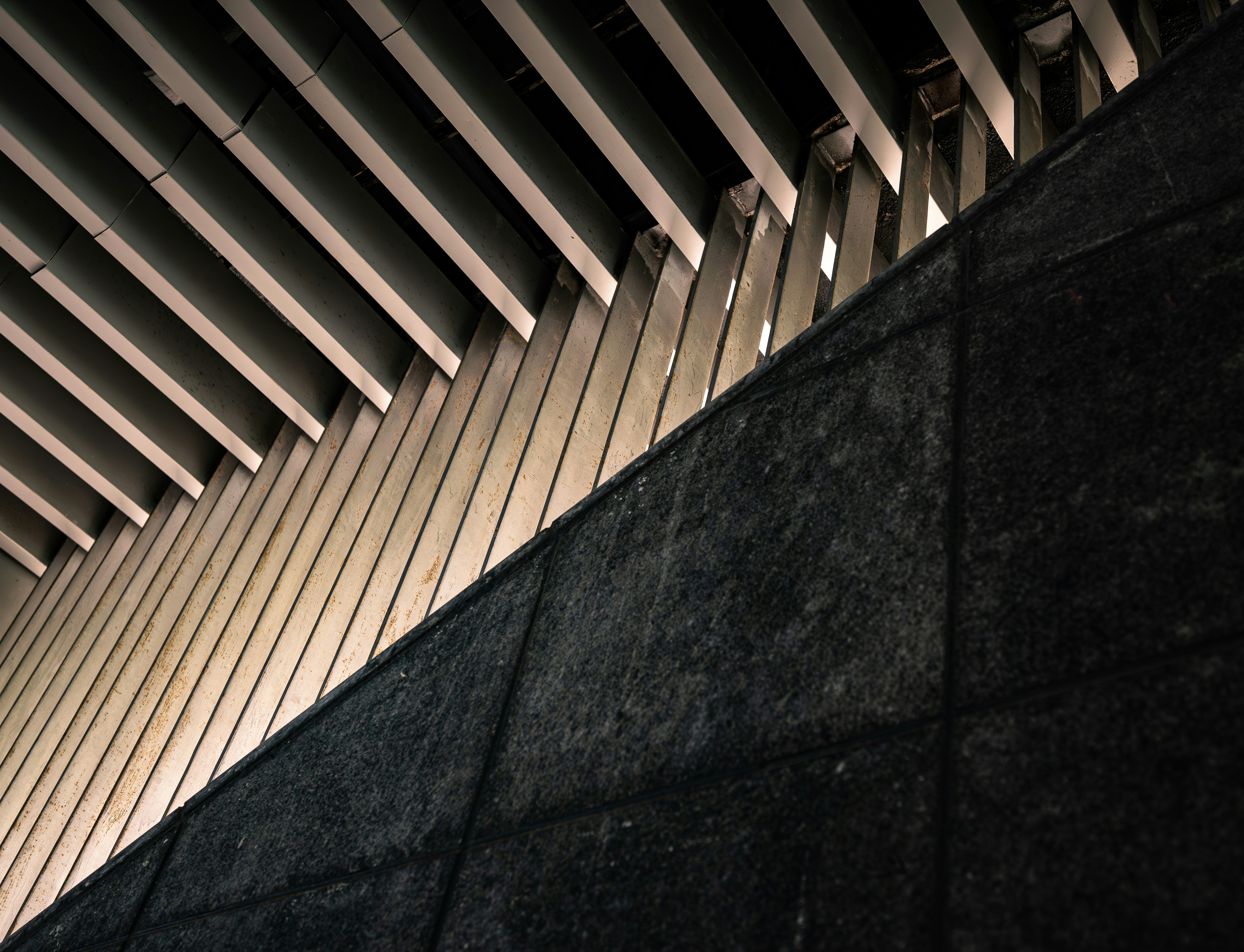Architectural detail features beams and a stone wall. photo – Free ...