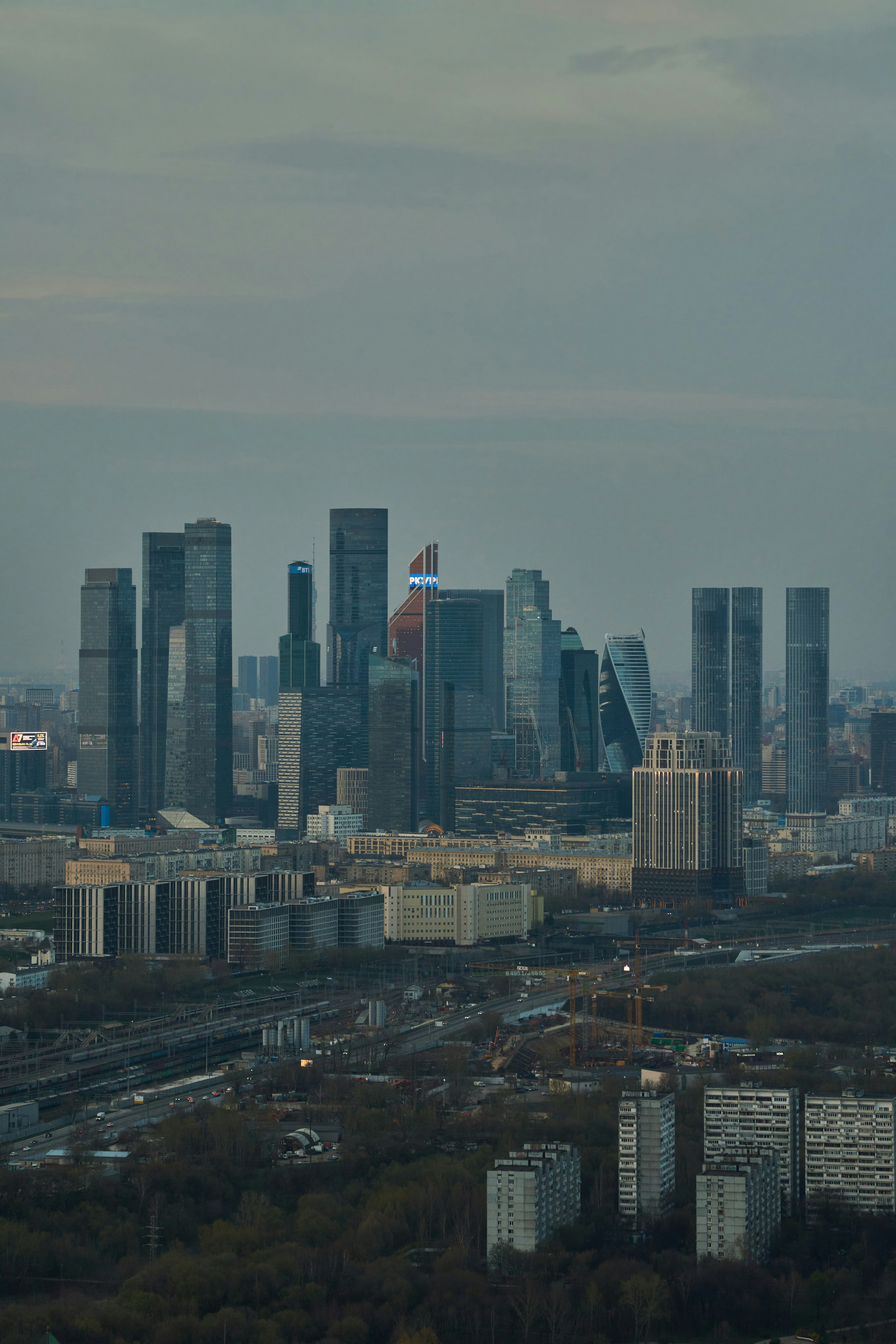 Skyscrapers dominate the cityscape on an overcast day. photo – Free ...