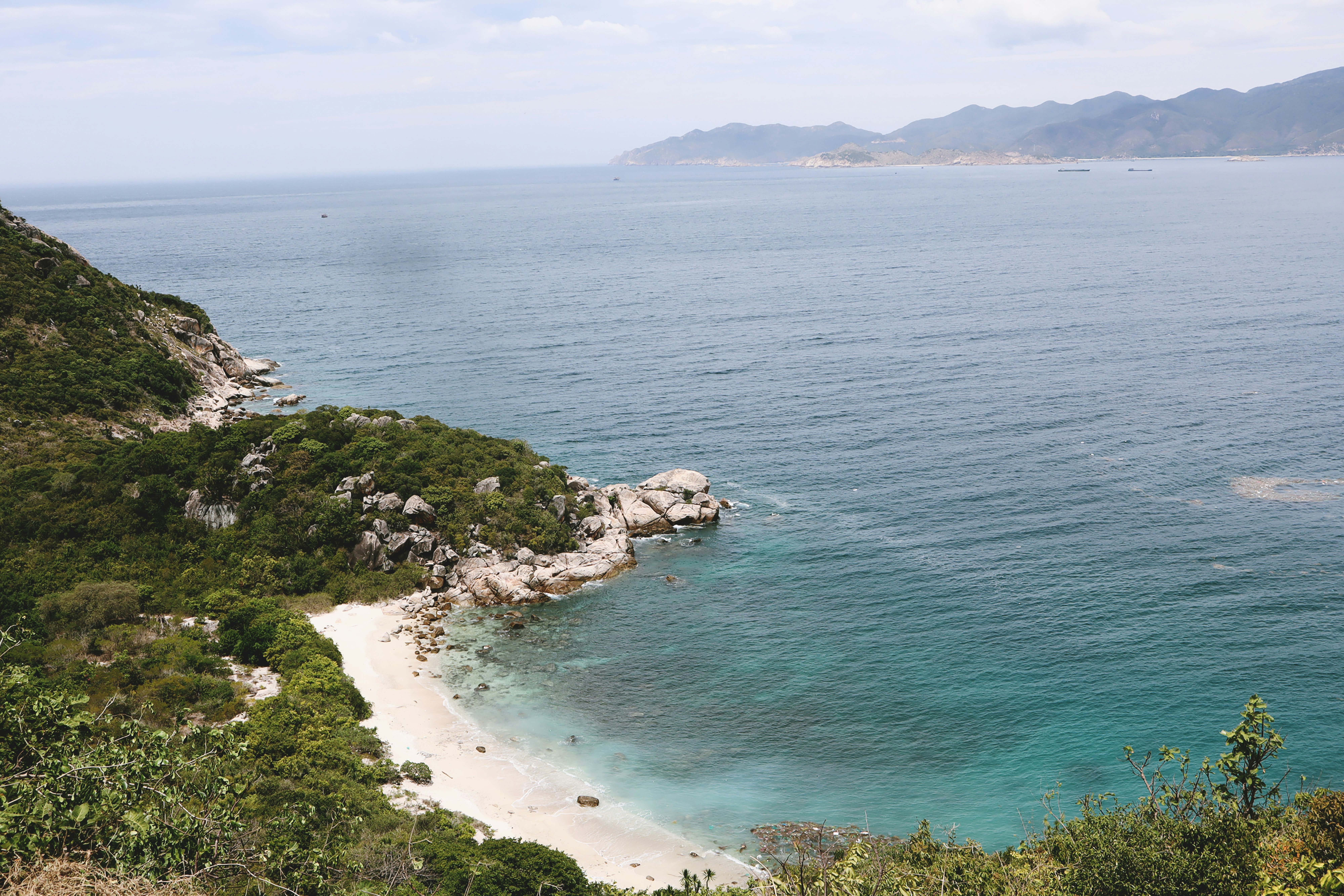 A beautiful coastal scene with beach and sea. photo – Free Beach Image ...