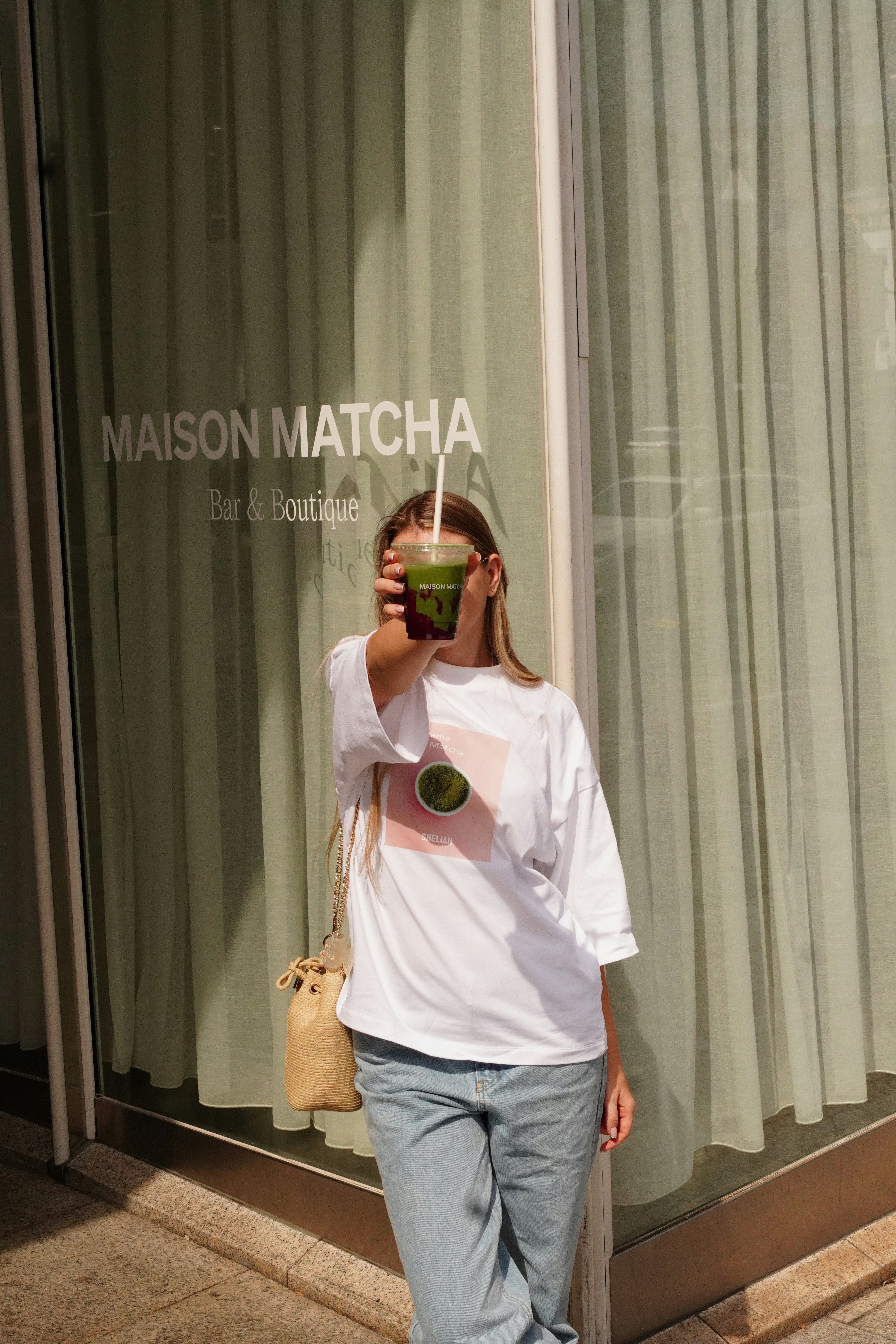 Person holds a matcha drink in front of their face. photo – Free ...