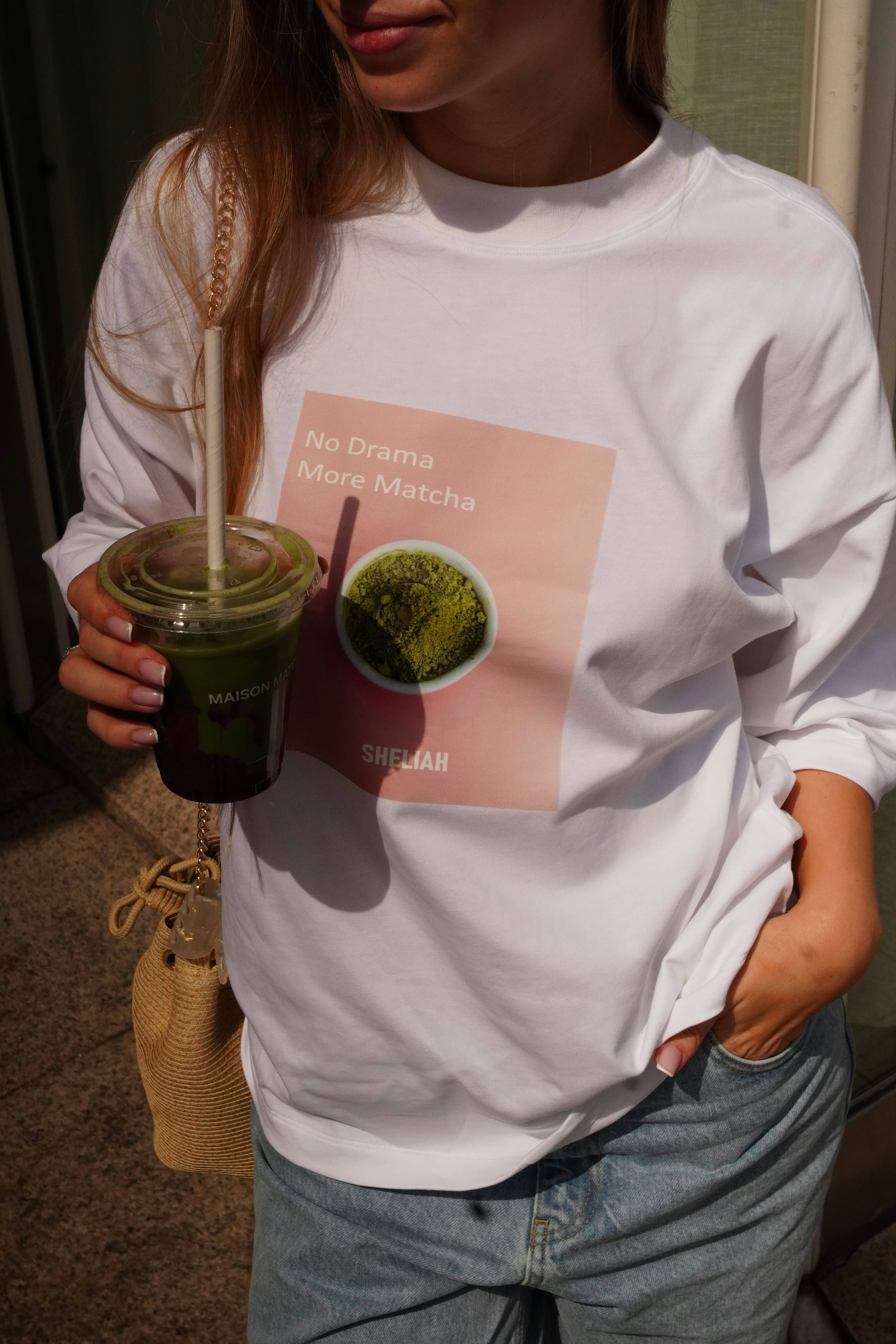 Woman holds matcha drink and wears a matcha shirt. photo – Free Text ...