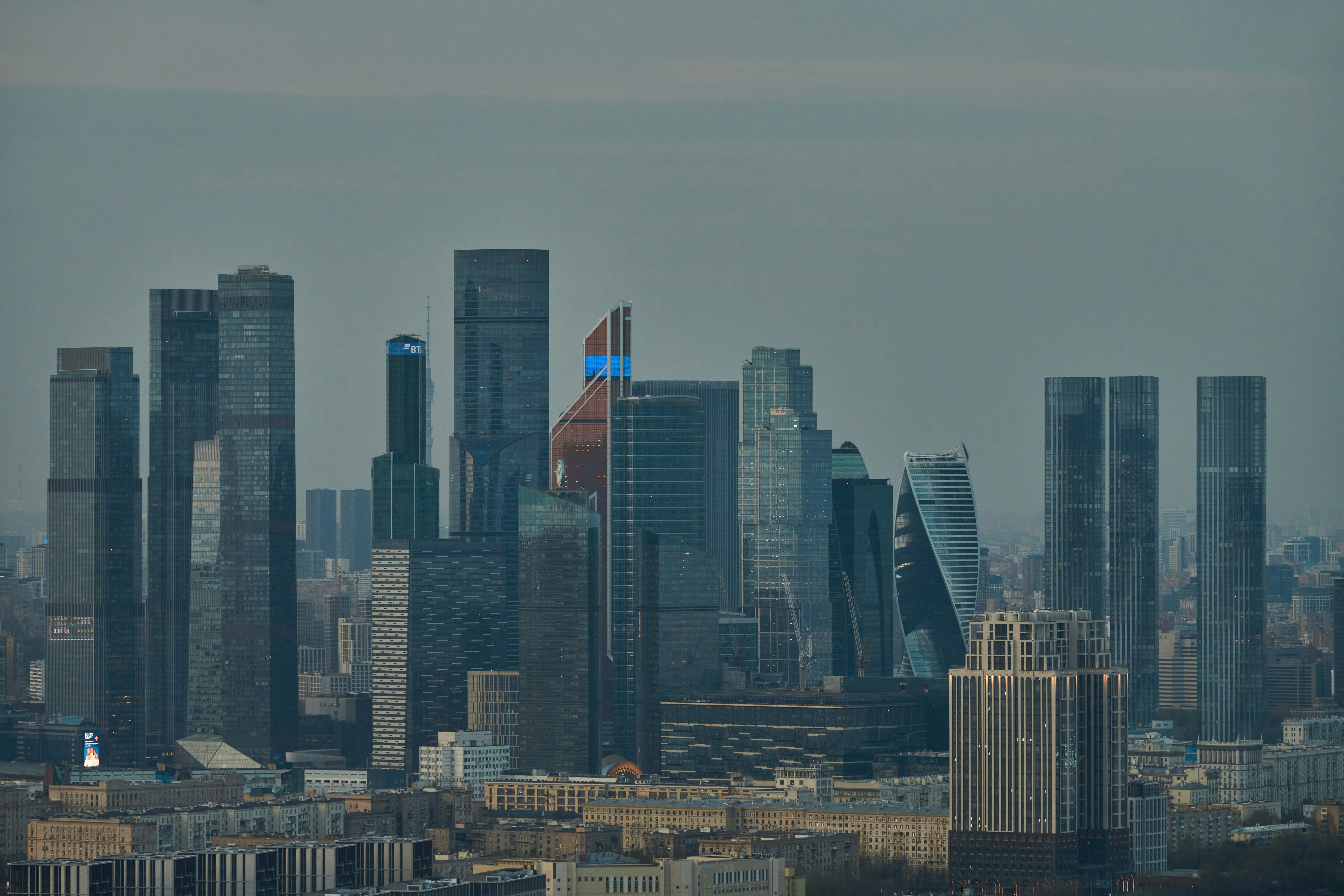 Modern skyscrapers dominate a hazy cityscape. photo – Free City Image ...