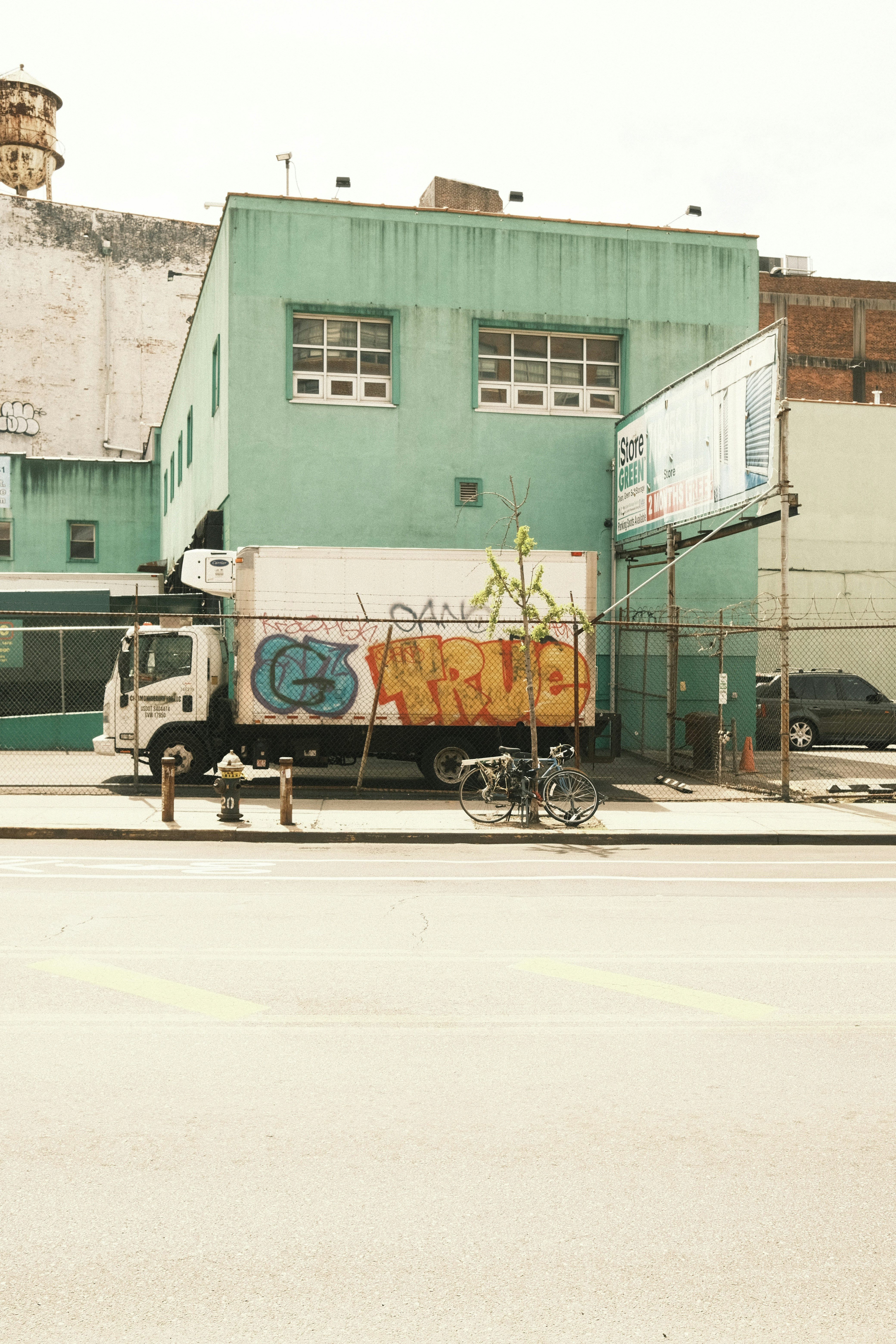 Minted Cargo: A Graffiti-Tagged Truck Anchors a Quiet Industrial Street