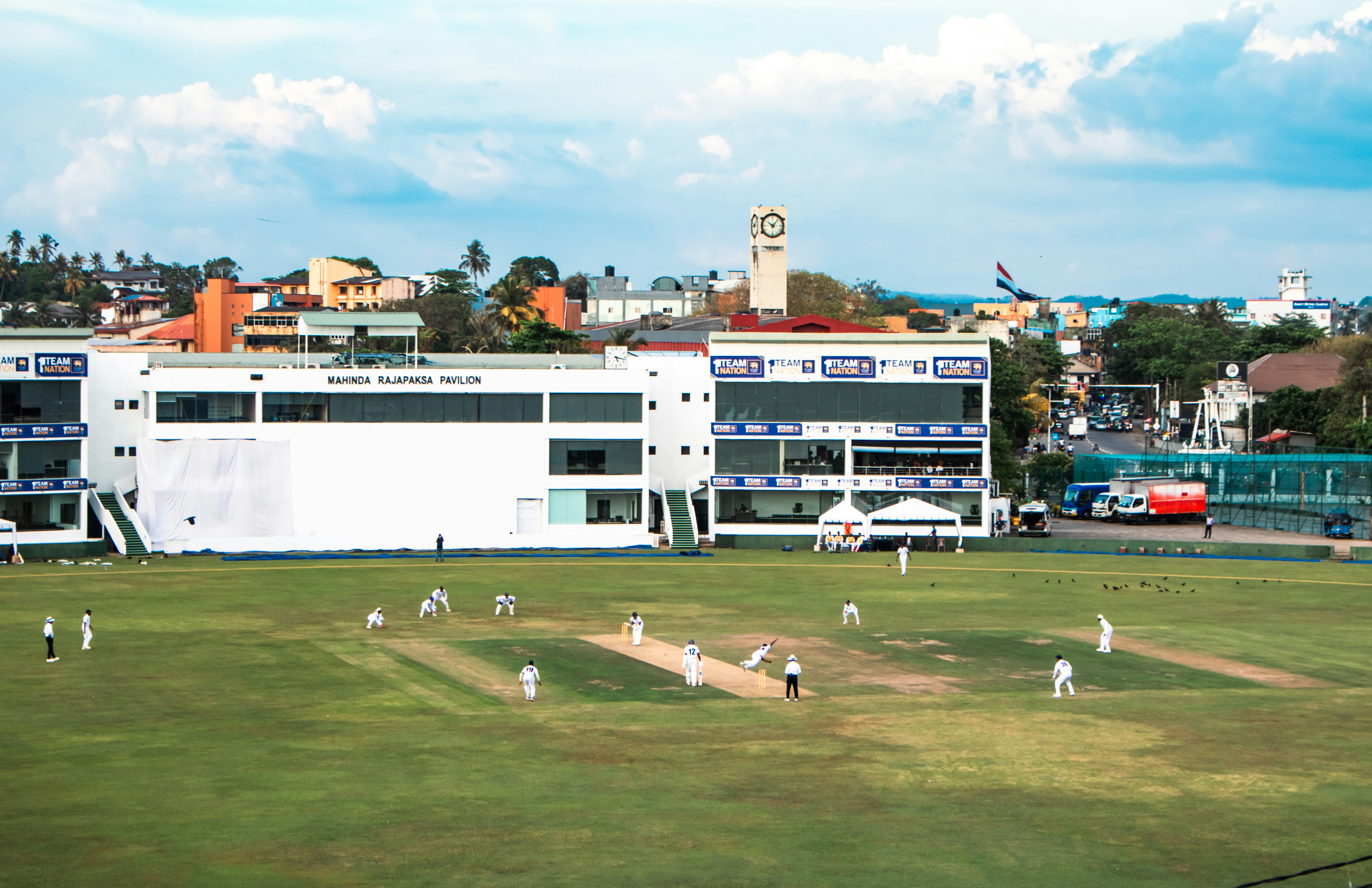Cricket match in progress at the stadium. photo – Free Team Image on ...