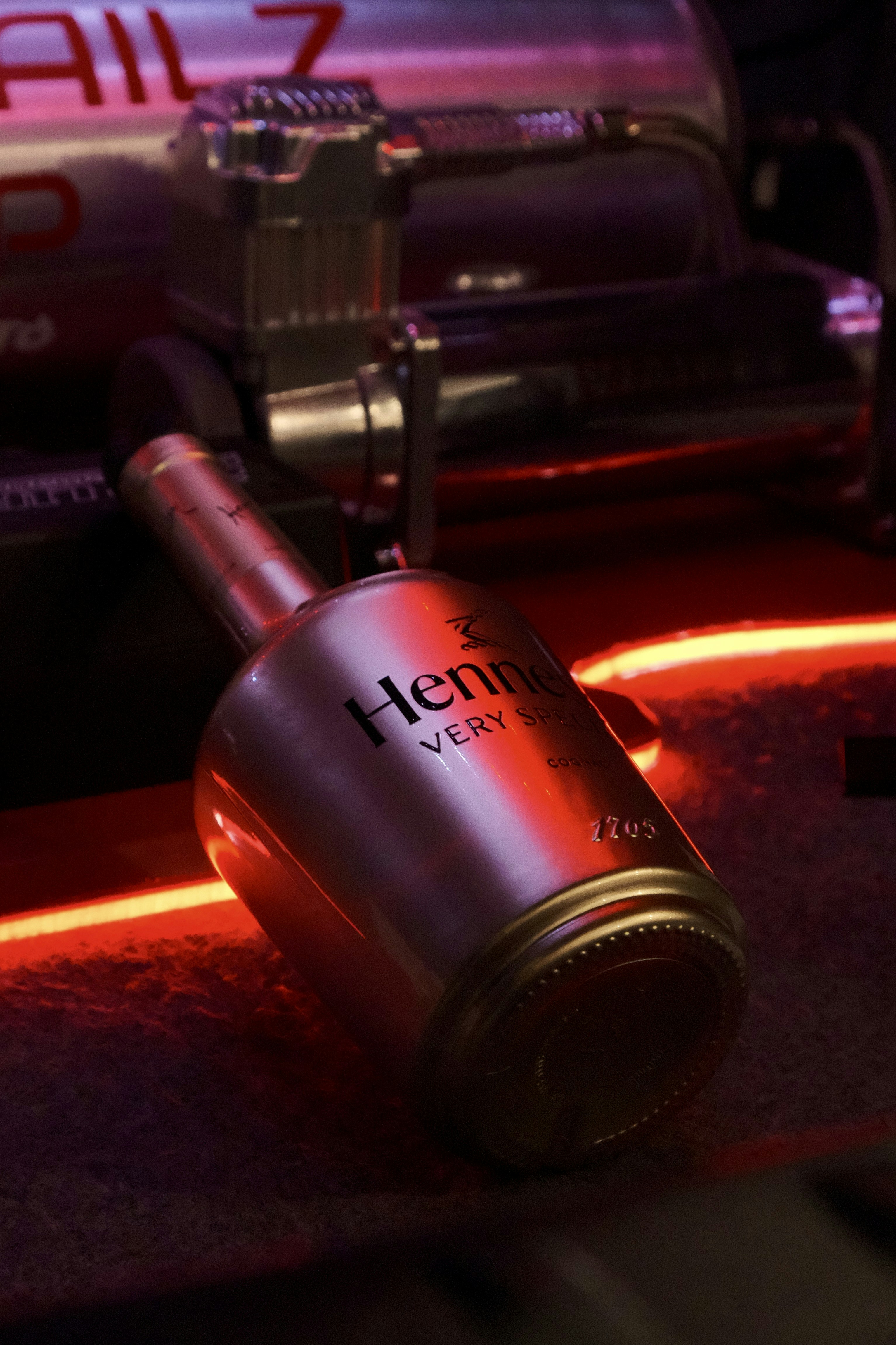 Hennessy bottle illuminated with red lights. photo – Free Car Image on ...