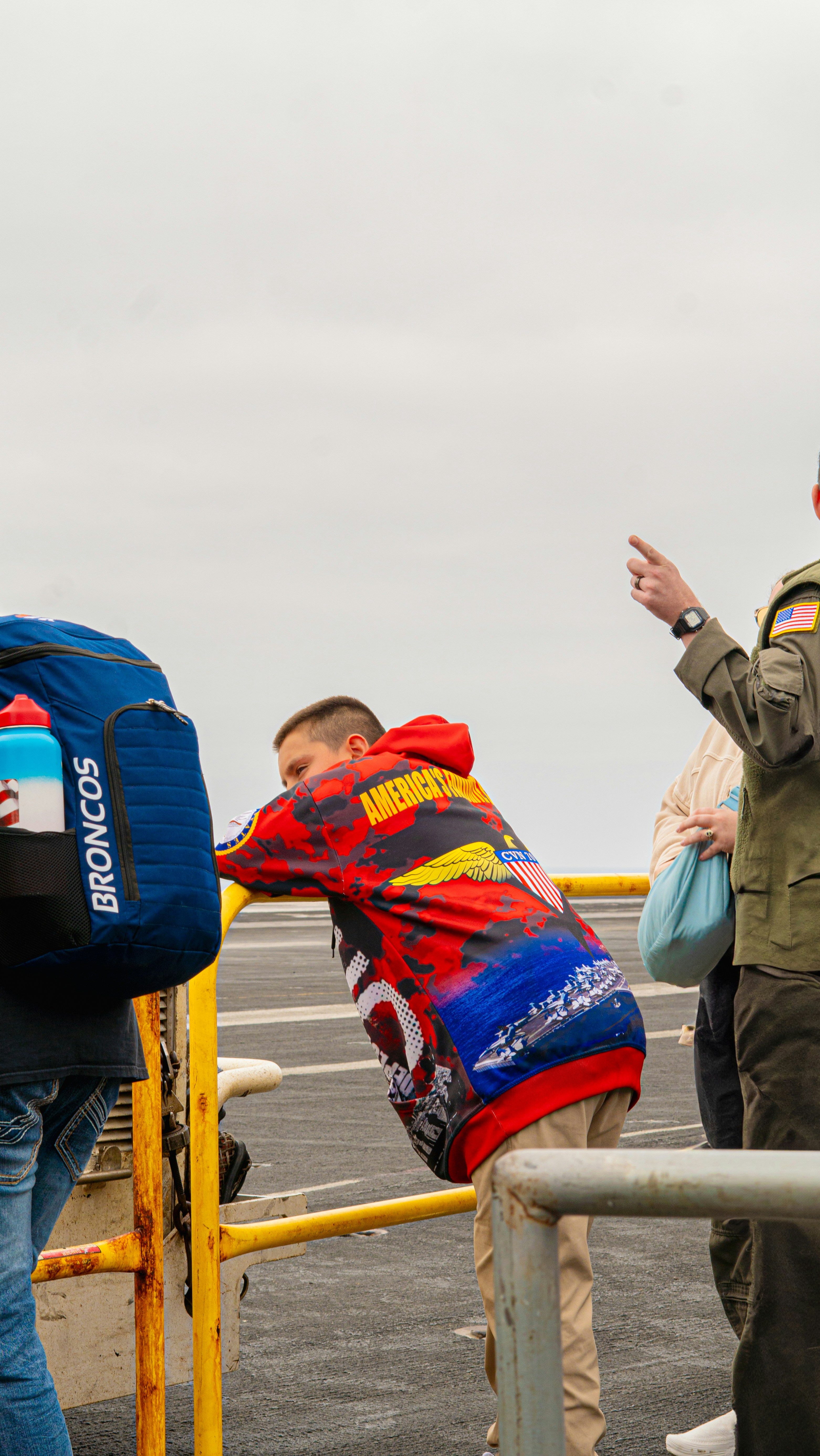 Rally at the Gate: A Crew Member Leaning Into the Barrier