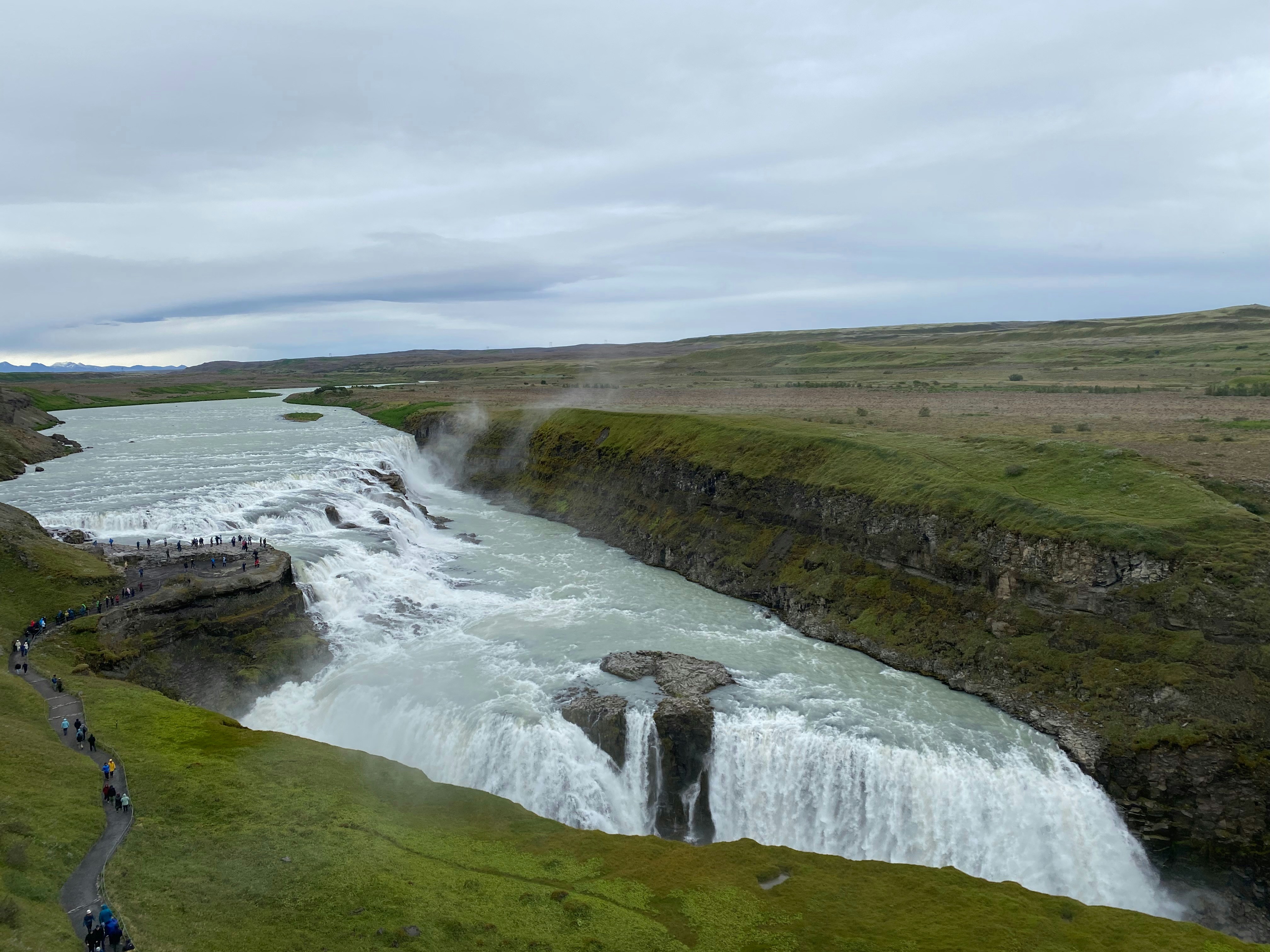 A stunning waterfall flows through a green landscape. photo – Free ...
