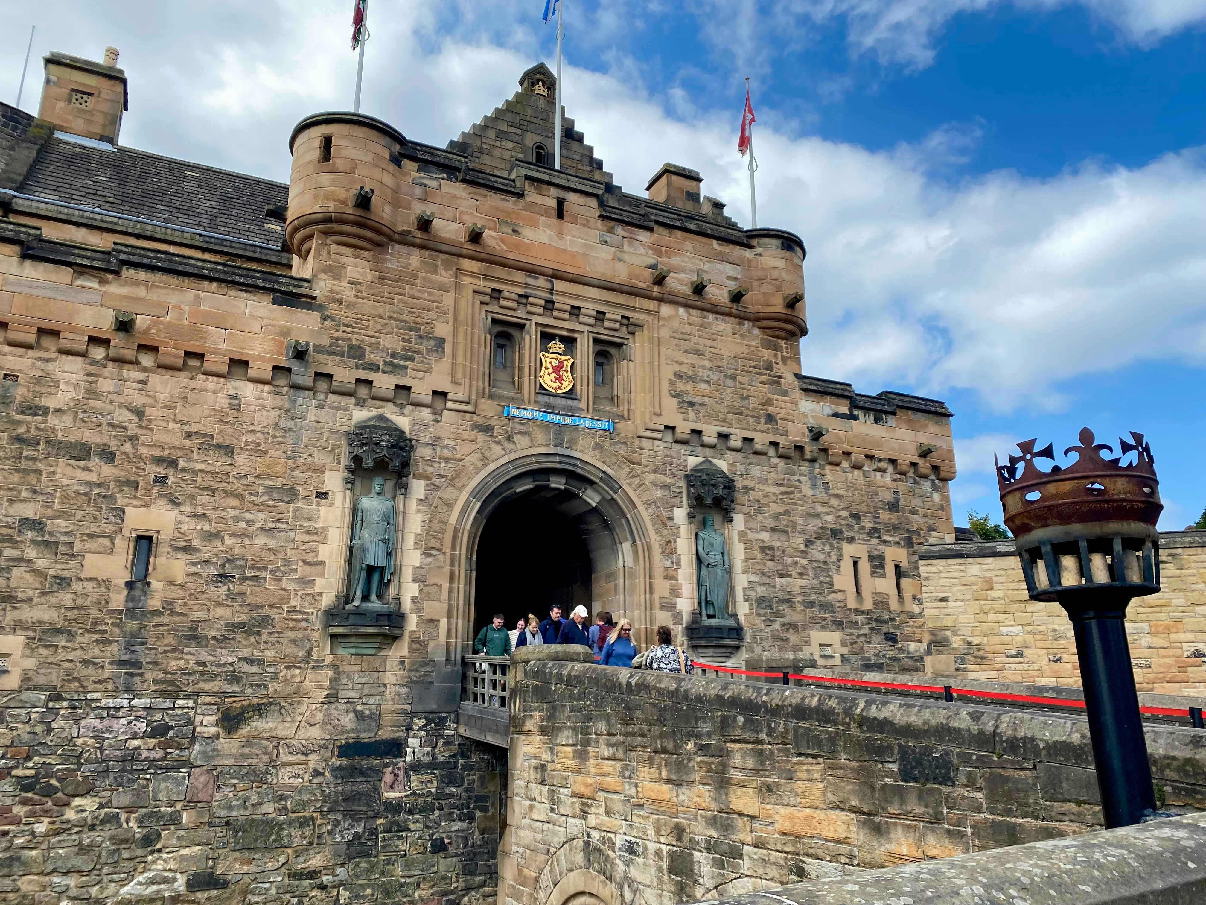Heraldic Gatehouse: Tourists on the Bridge Beneath the Castle Arch