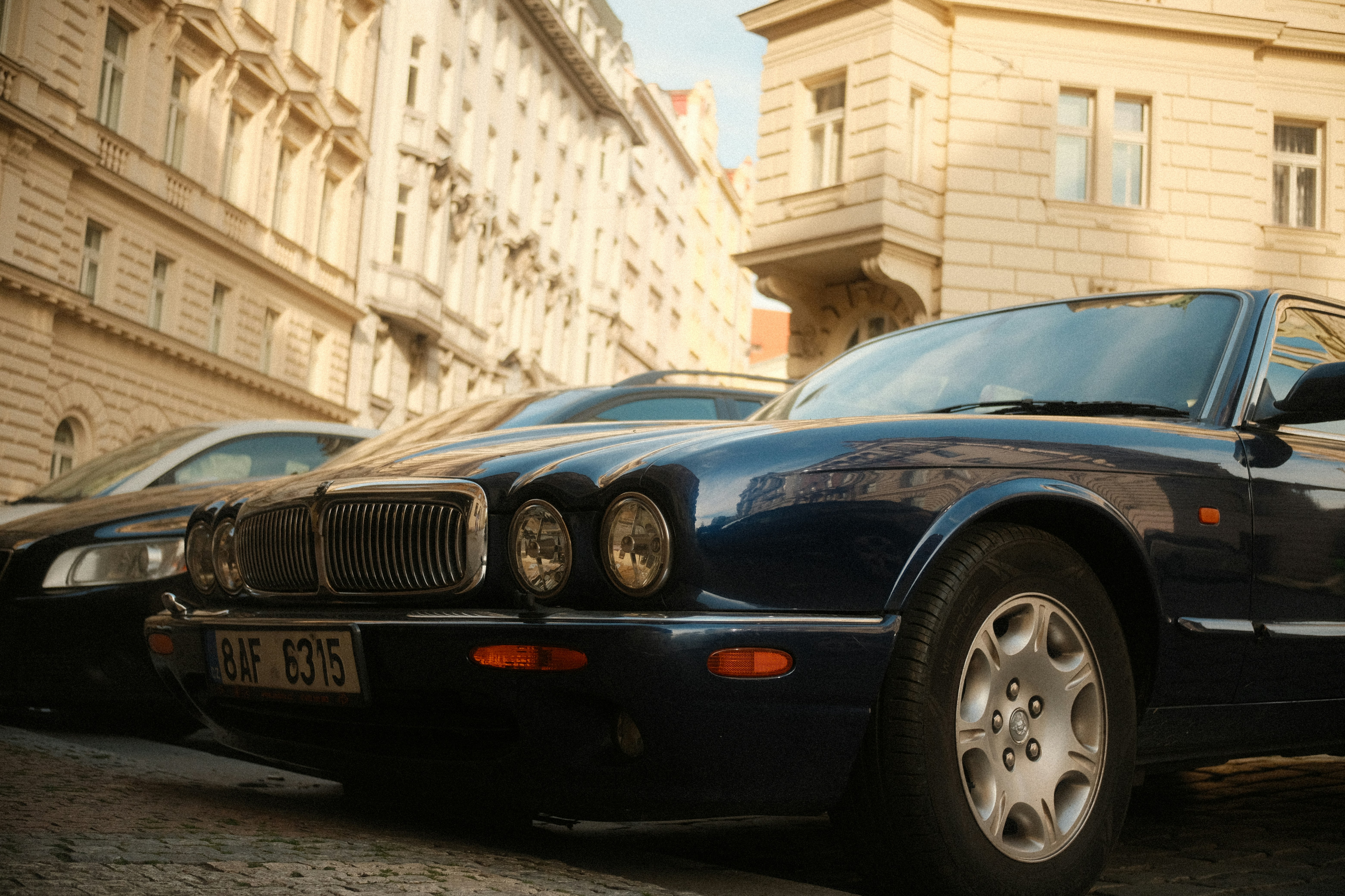 Blue Classic on Cobblestones: a Quiet European Street Portrait