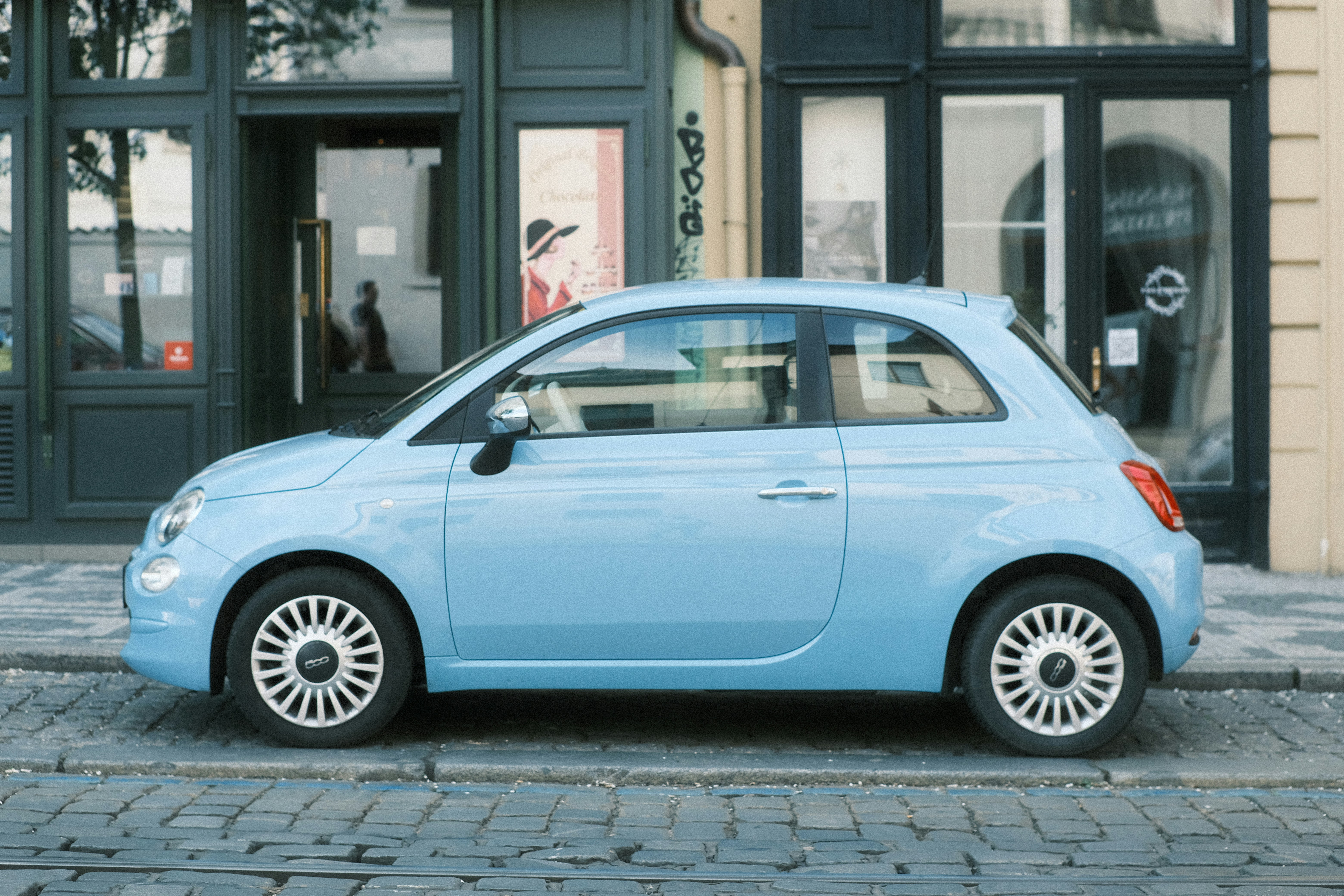 A light blue fiat 500 parked on the street. photo – Free Travel Image ...