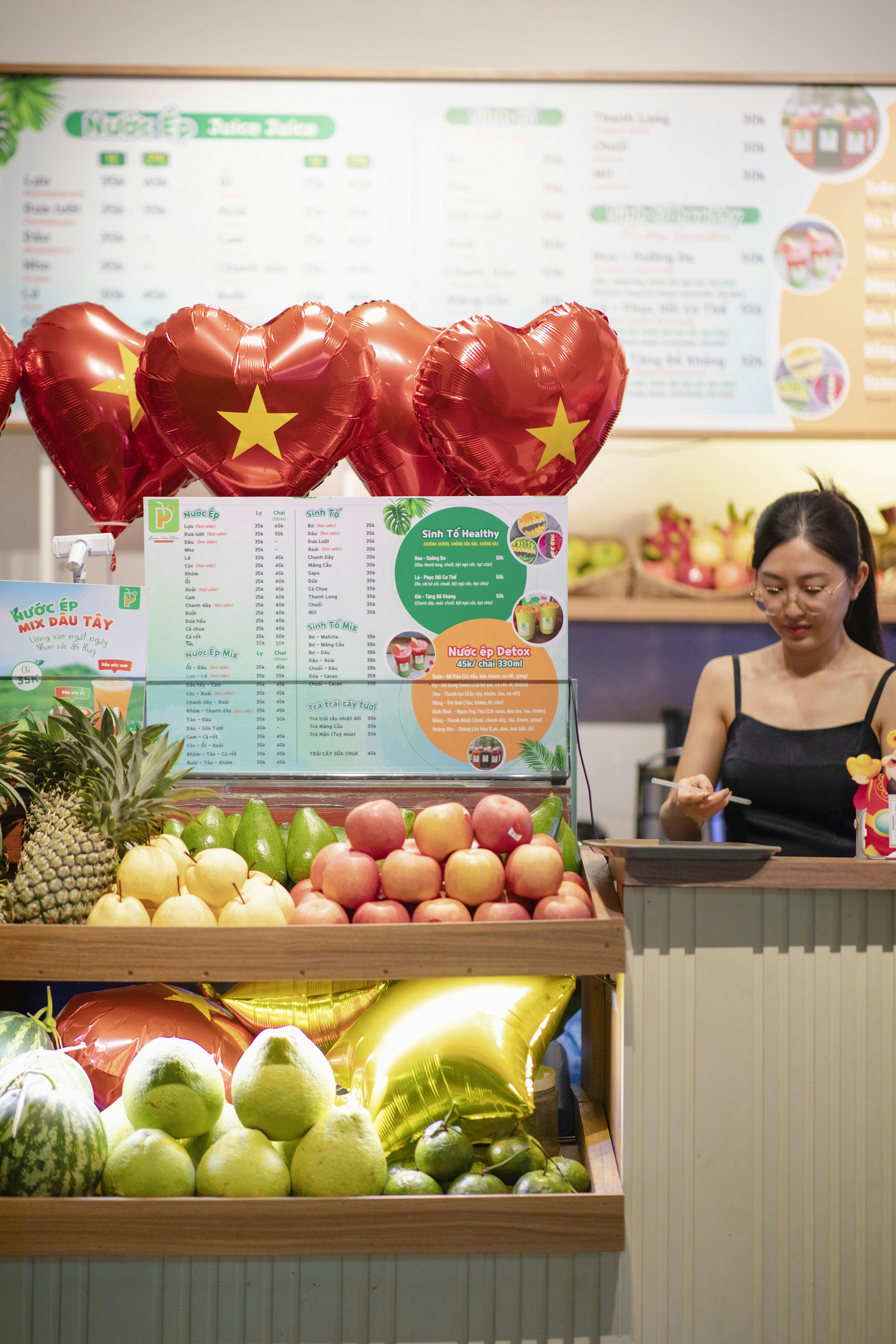 Heart Balloons with Vietnam Flag Hover Over a Lively Produce Counter