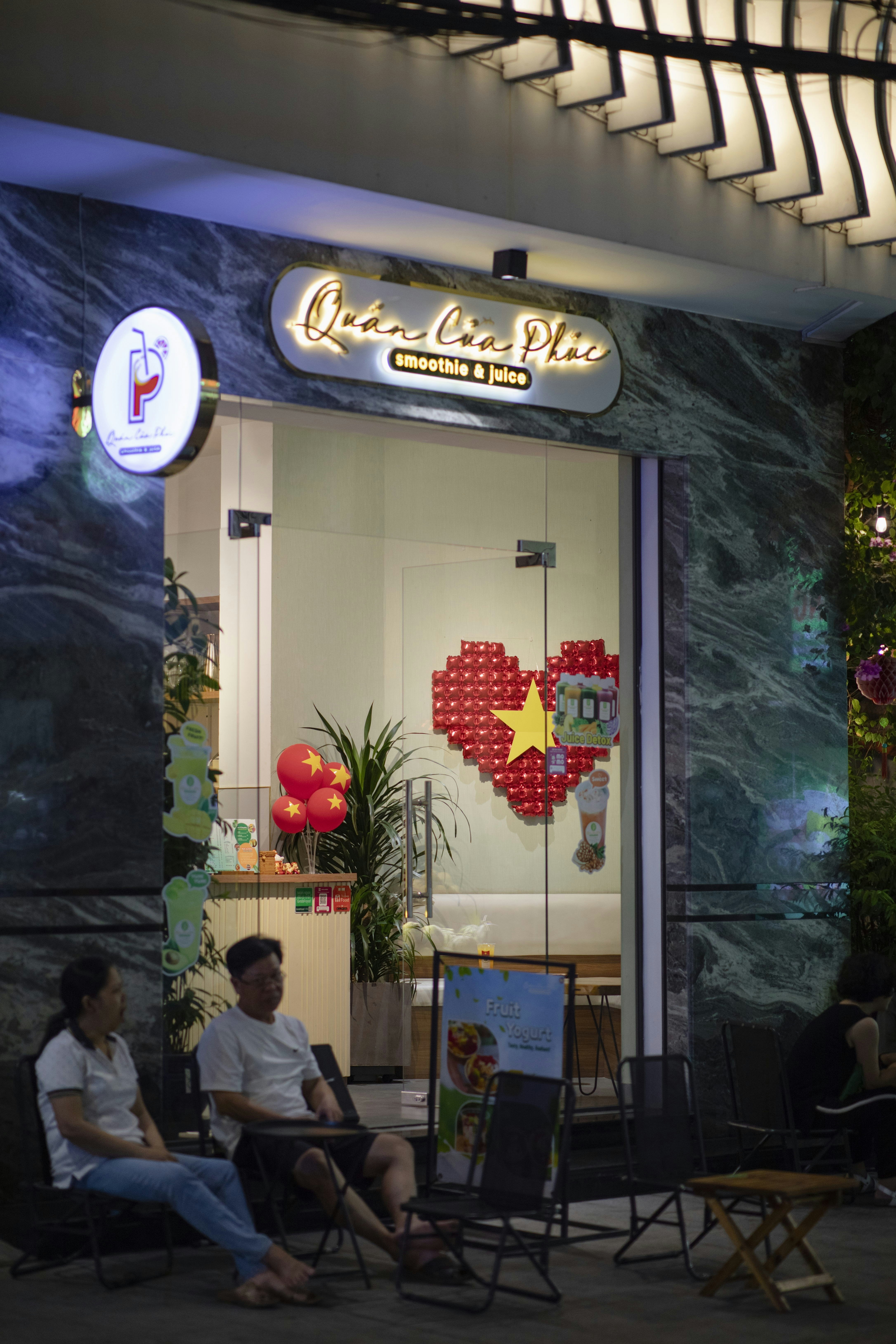 Night Market Café: Neon Sign, Hearts, and Lanterns Framing a Quiet Street
