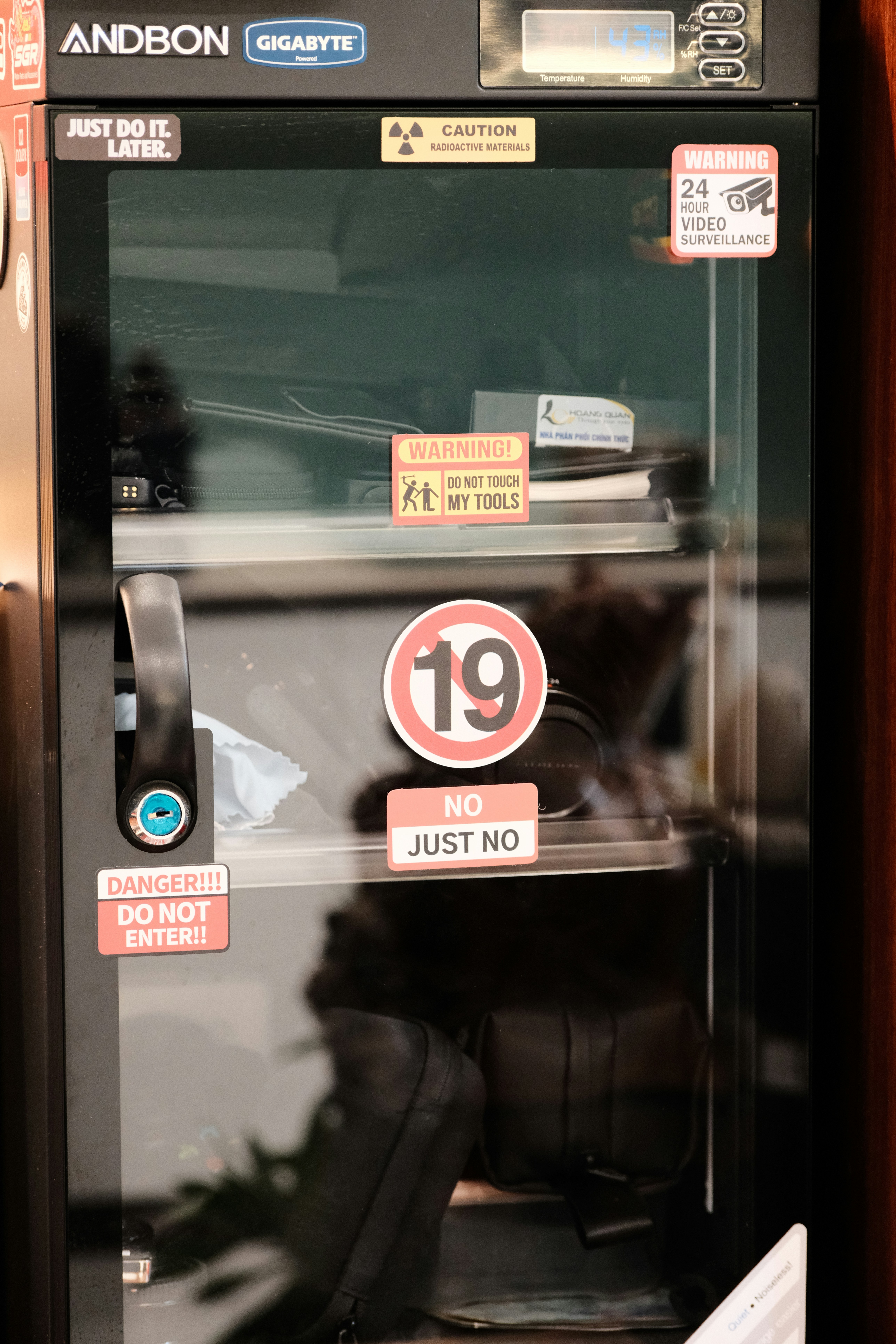 A cabinet is covered in warning signs and labels. photo – Free Tape ...