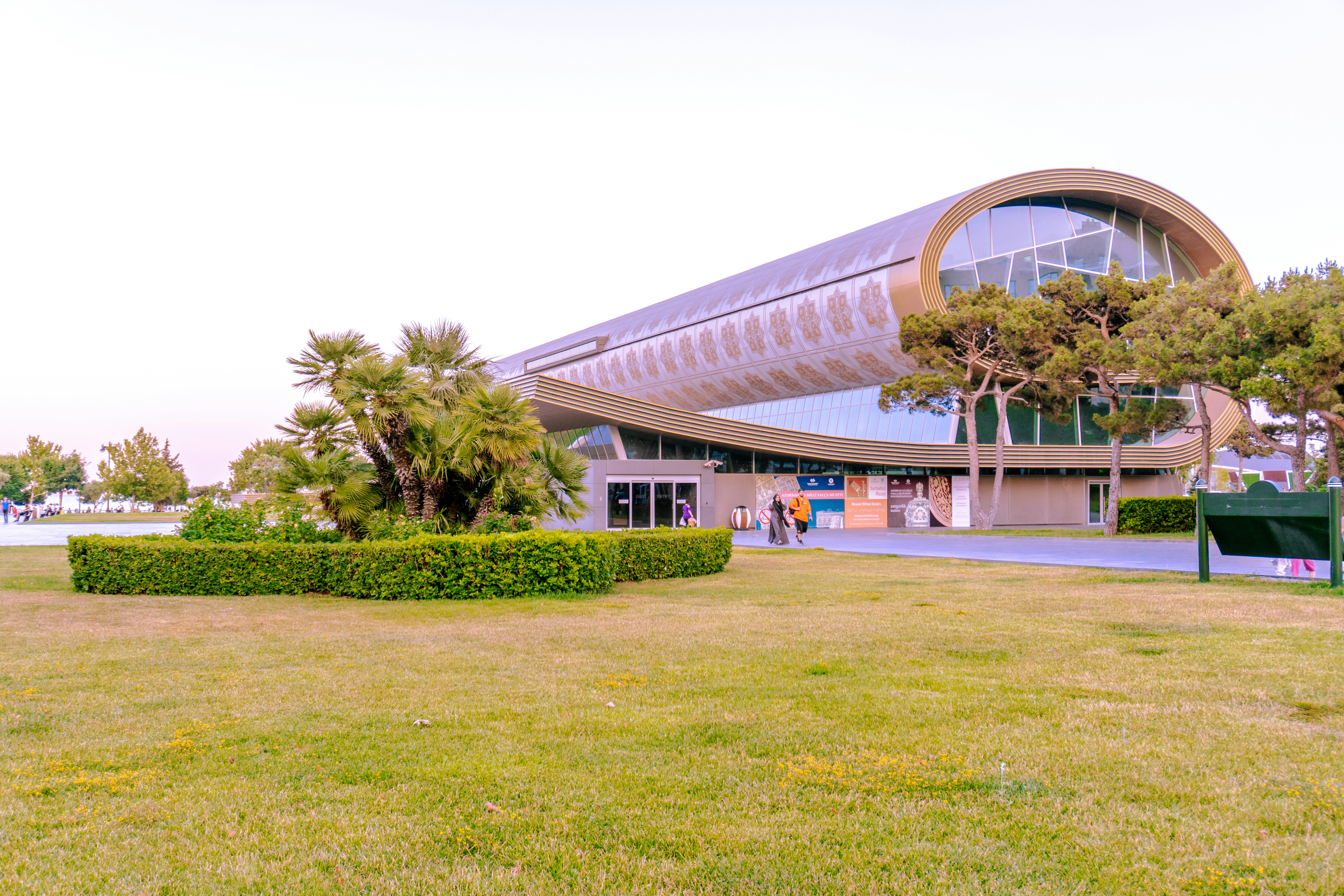 A modern building stands on a well-kept lawn. photo – Free Building ...