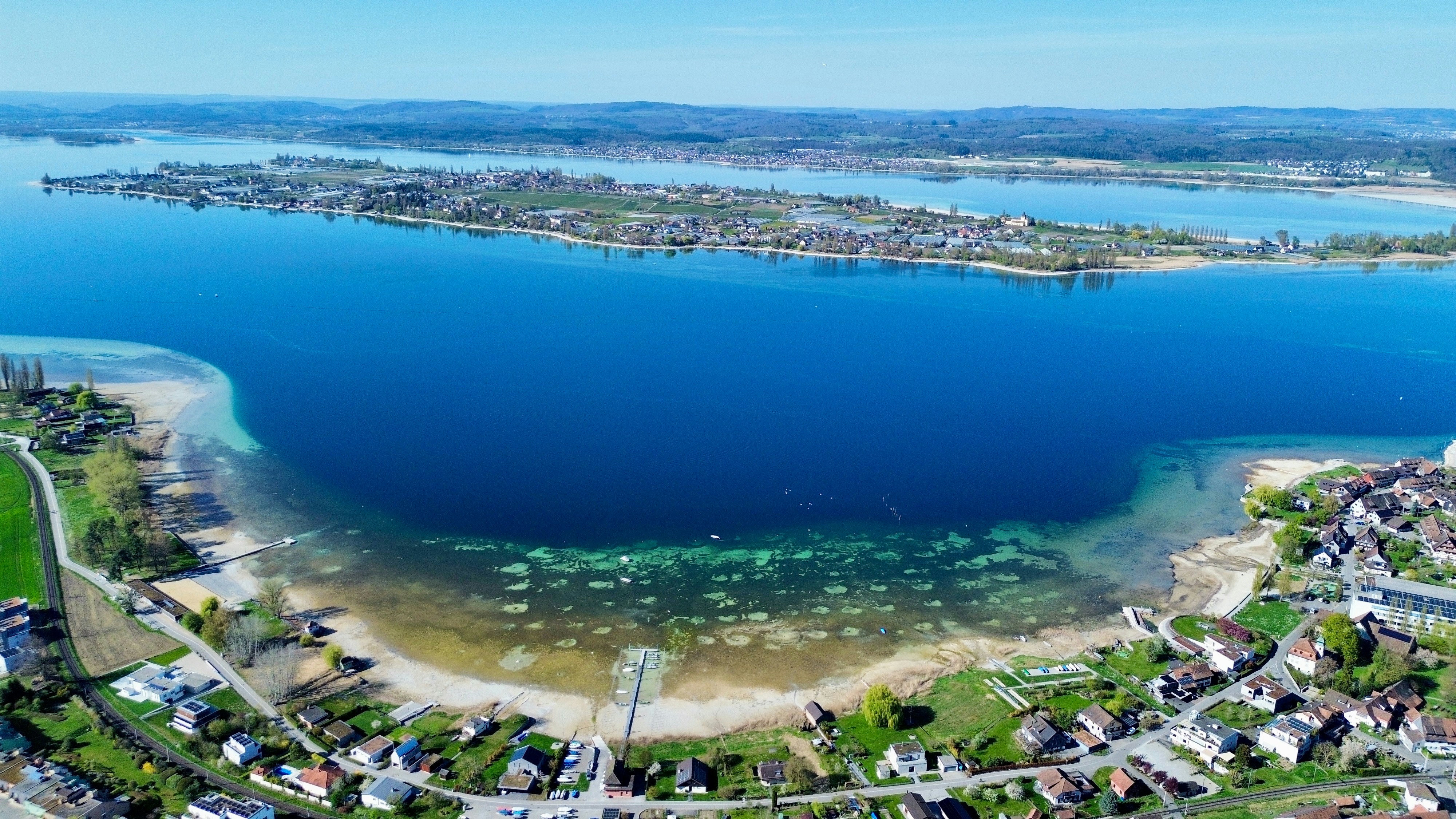 Lakeside Settlement Fringed by a Shallow Reef and Shoreline