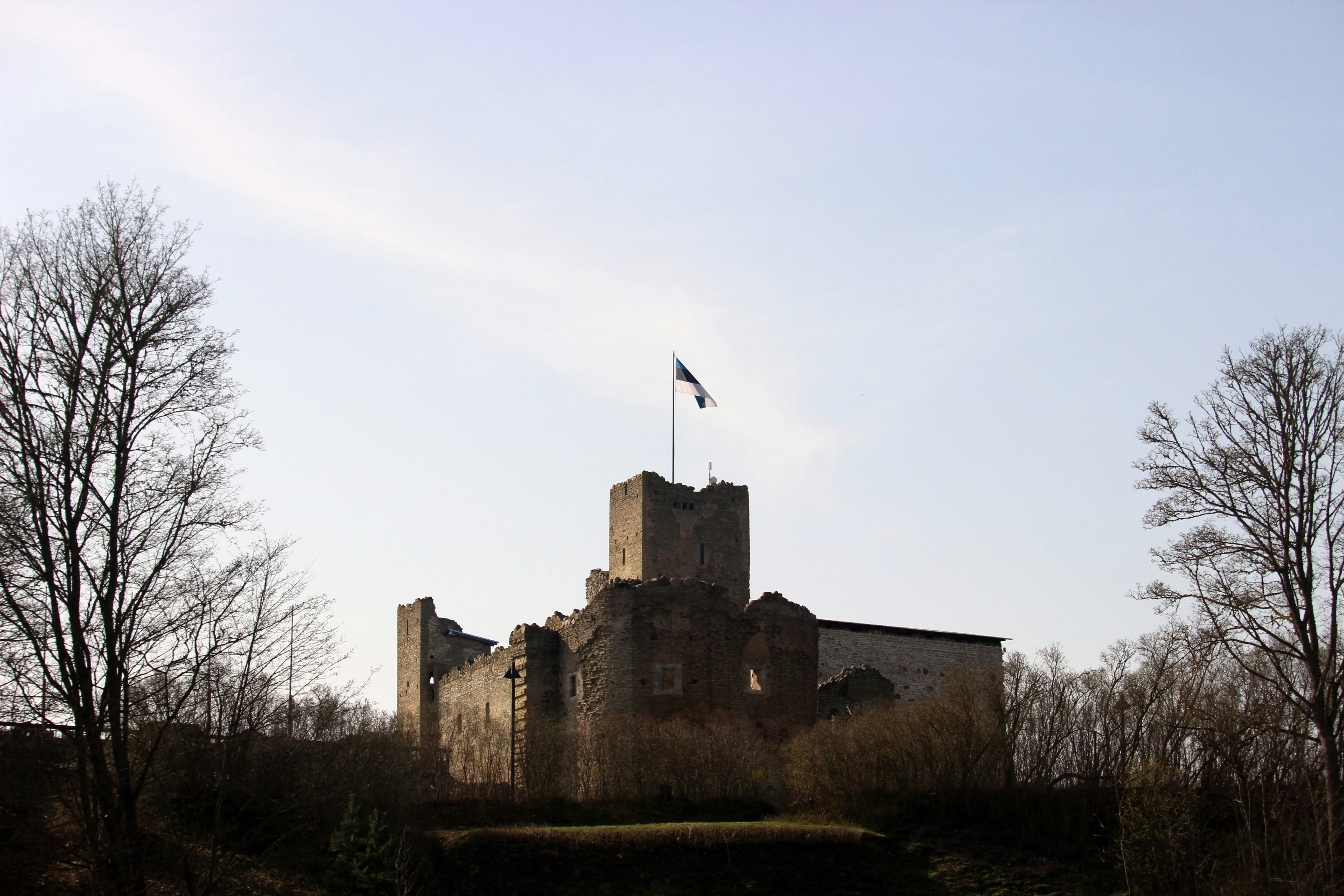 A castle perched atop a hill under the sun. photo – Free Castle Image ...