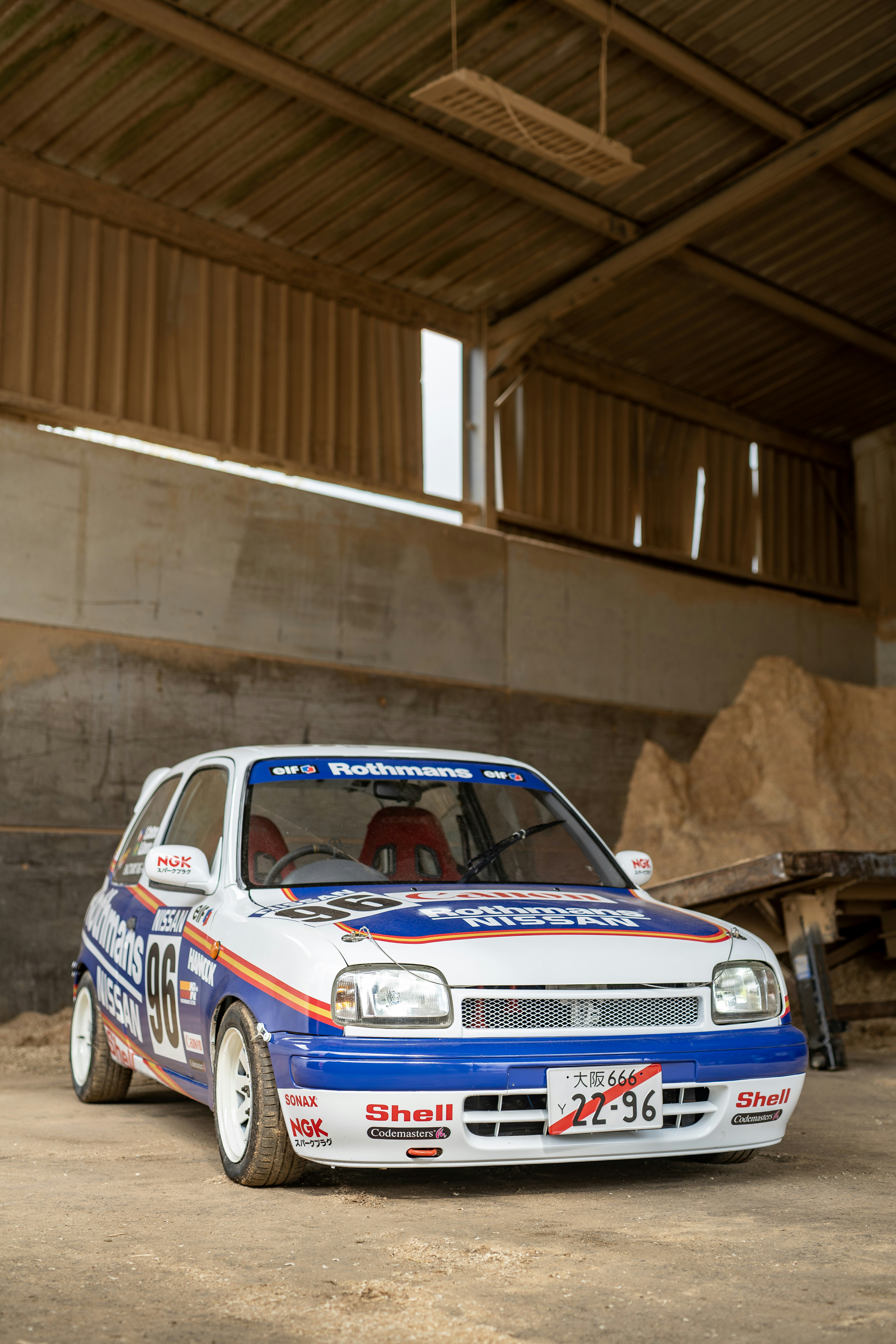 Rothmans Rally Hatchback Resting in a Dusty Indoor Warehouse