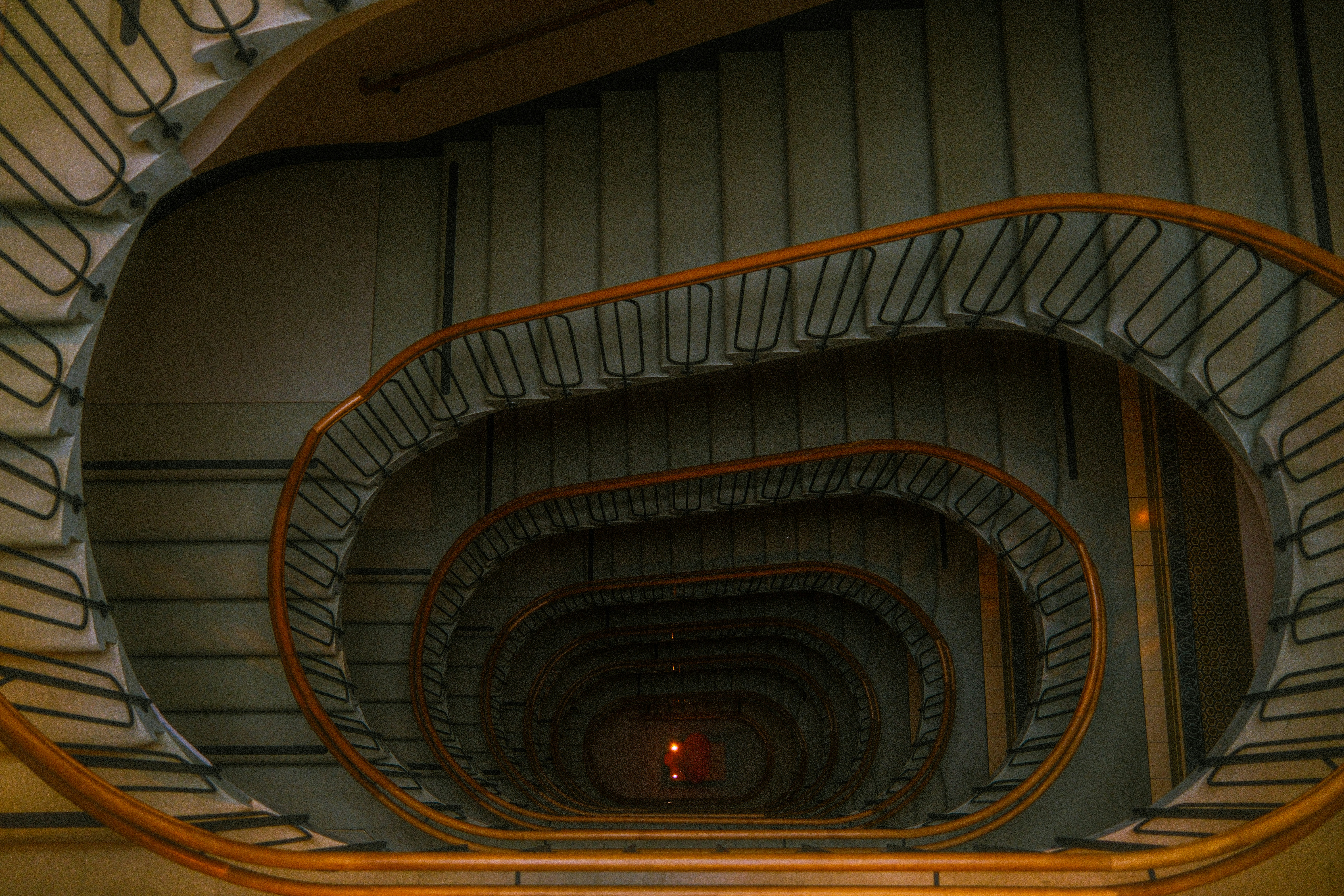 Descending Copper Rings: A Red Beacon at the Heart of the Spiral