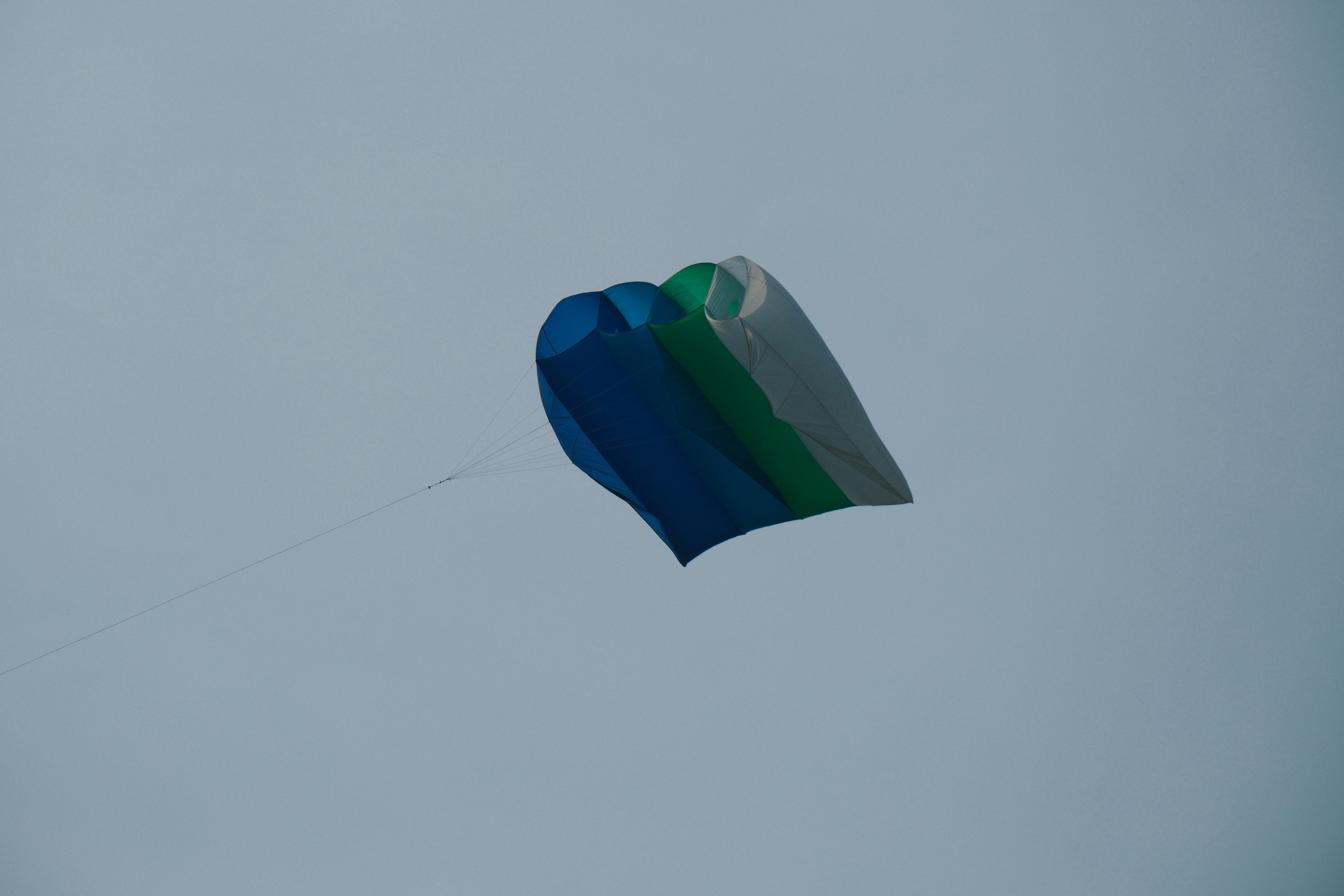Blue-Green Arc Over a Quiet Sky