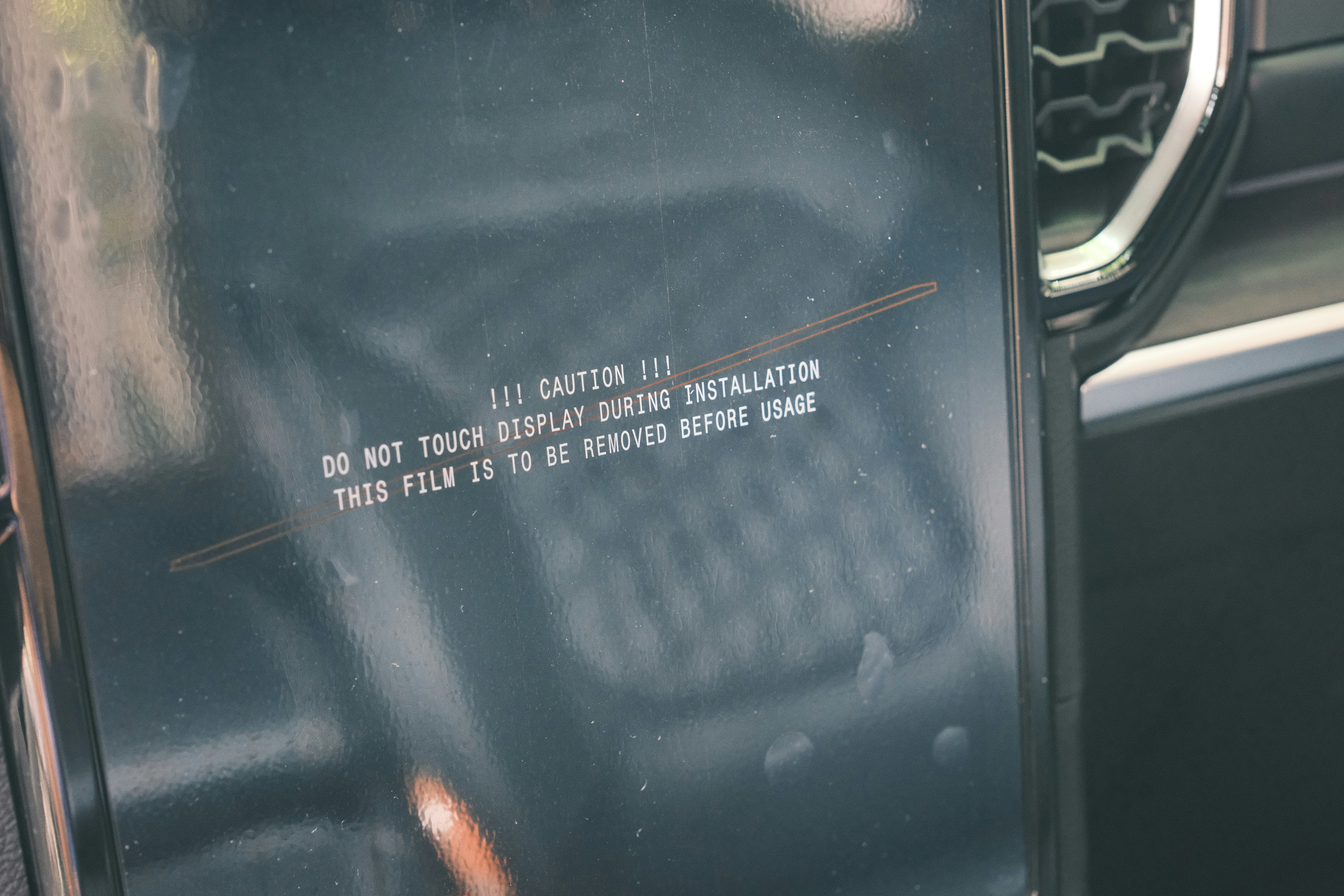 A caution message is visible on a display screen. photo – Free Vehicle ...