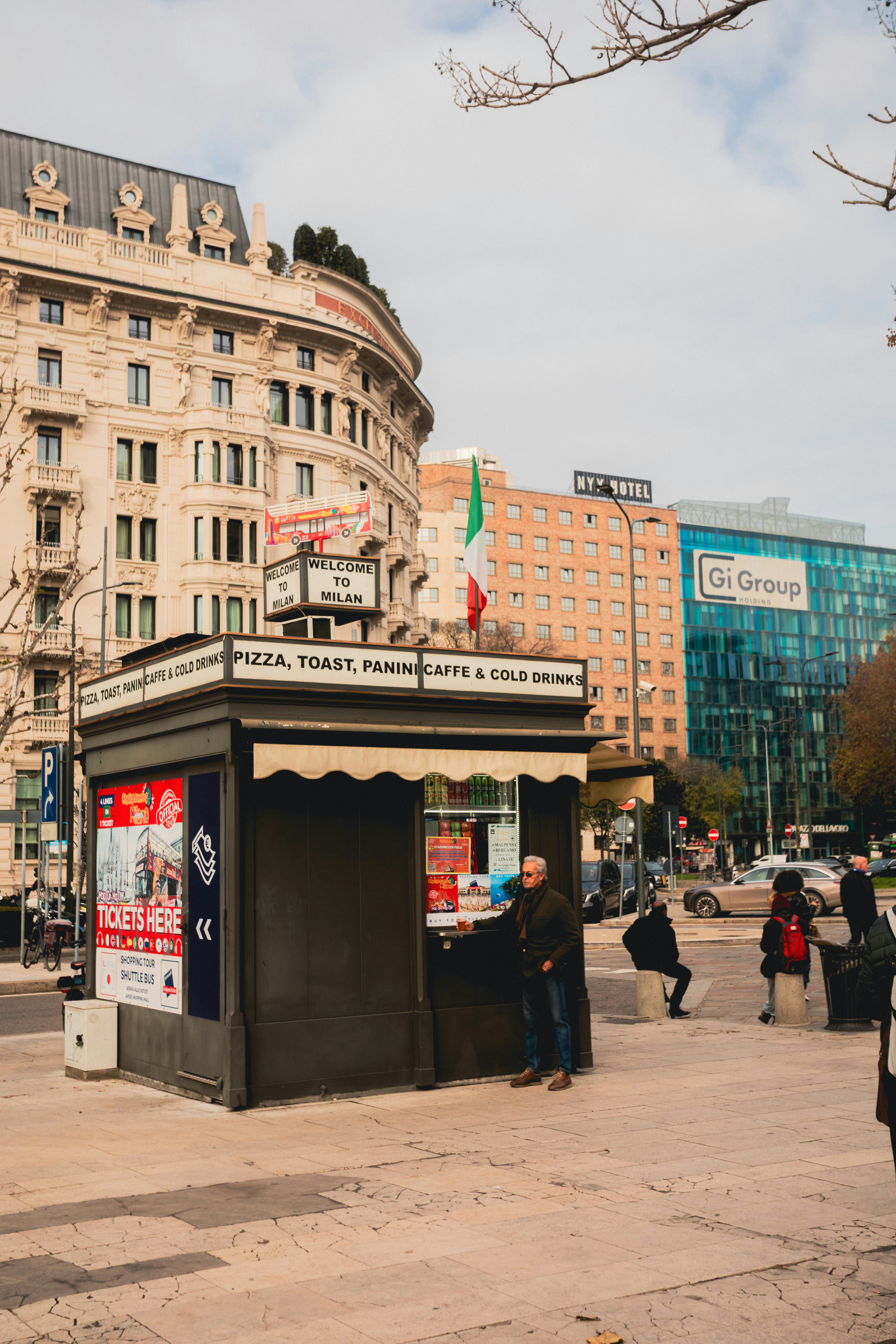 A street scene in milan with an italian kiosk. photo – Free Photo Image ...