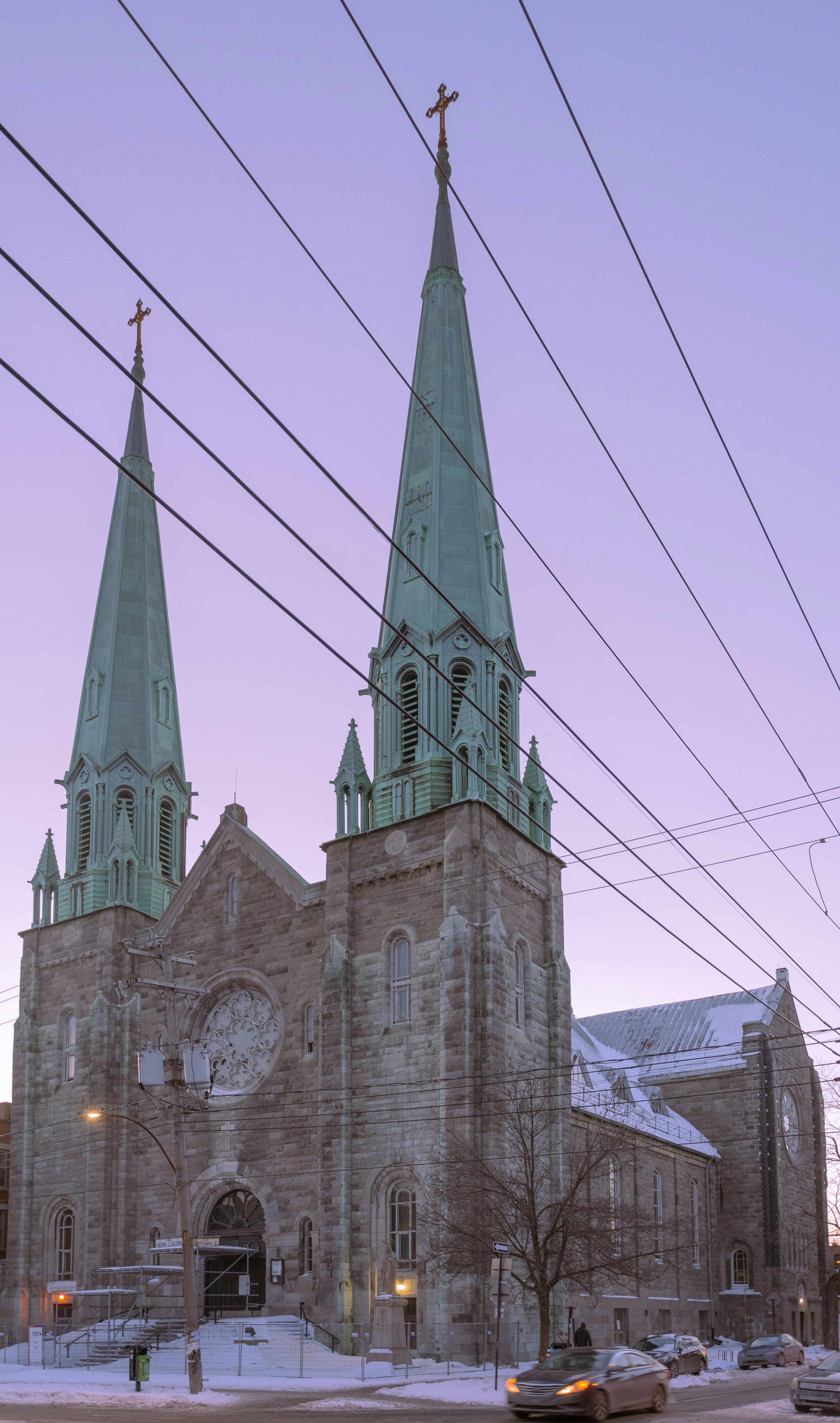Teal Spires in a Snow-Blanketed Twilight Under a Web of Wires