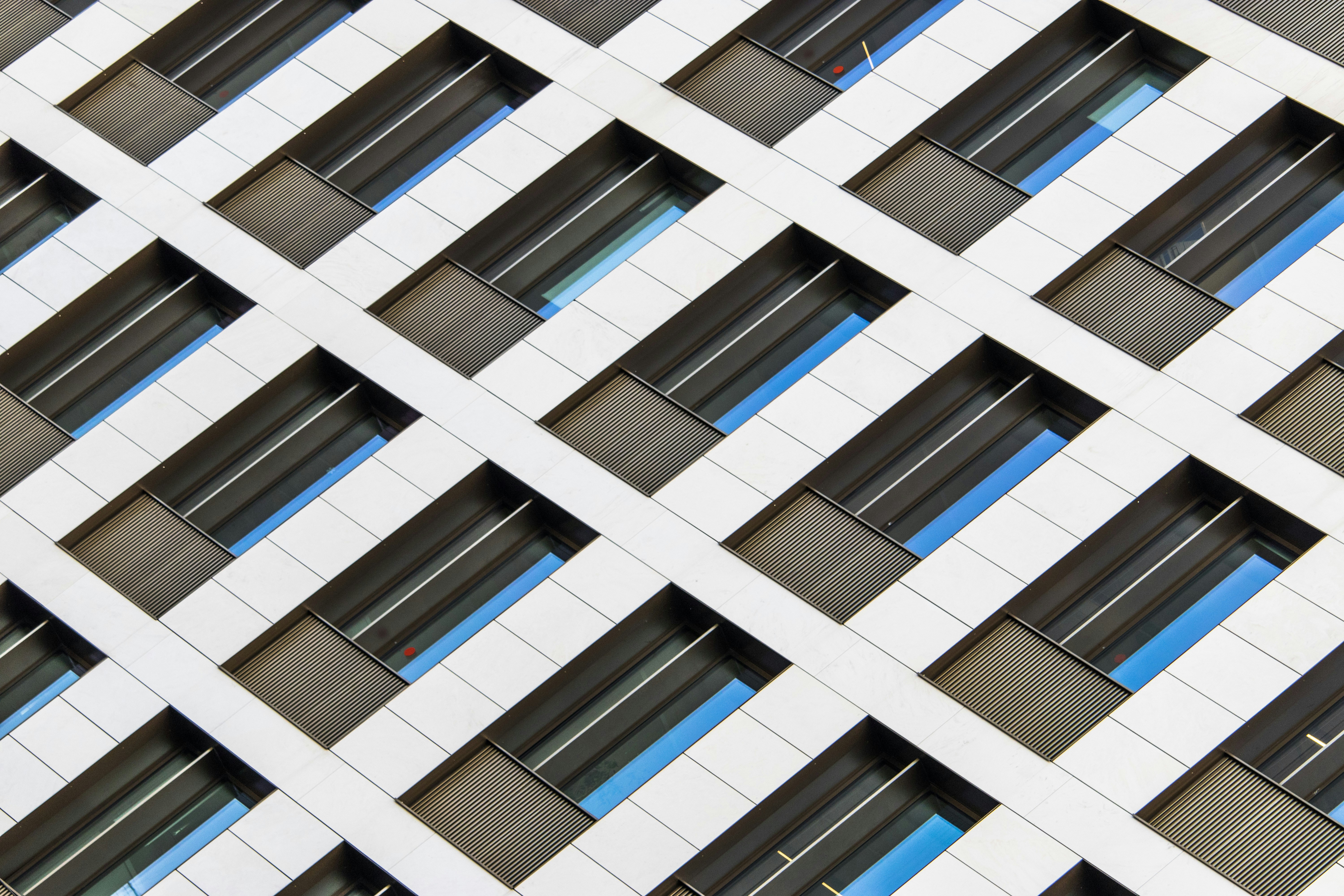 Diagonal building windows in a repeating pattern. photo – Free Building ...
