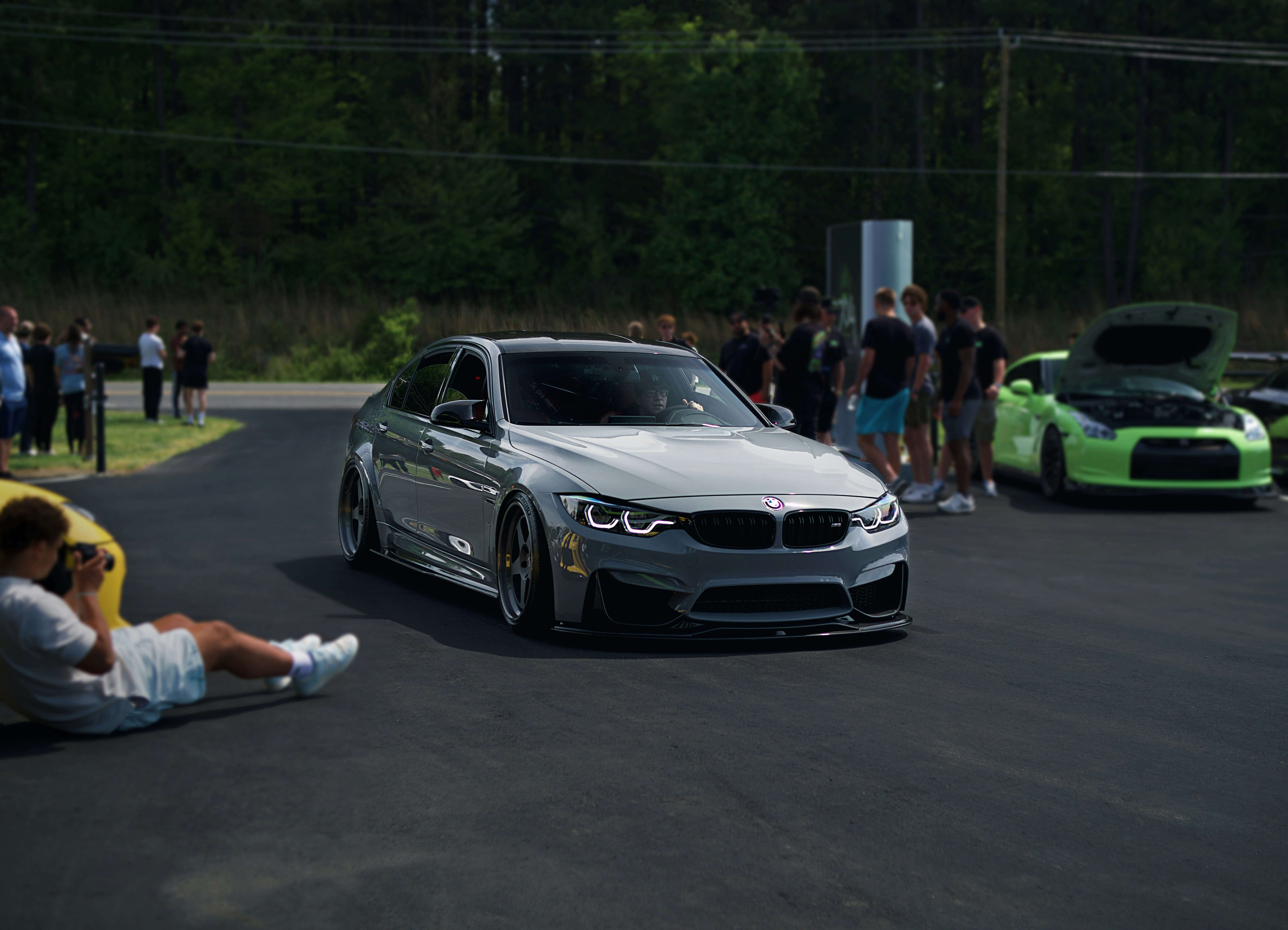 Midnight Predator: A Silver BMW Leads the Car Meet