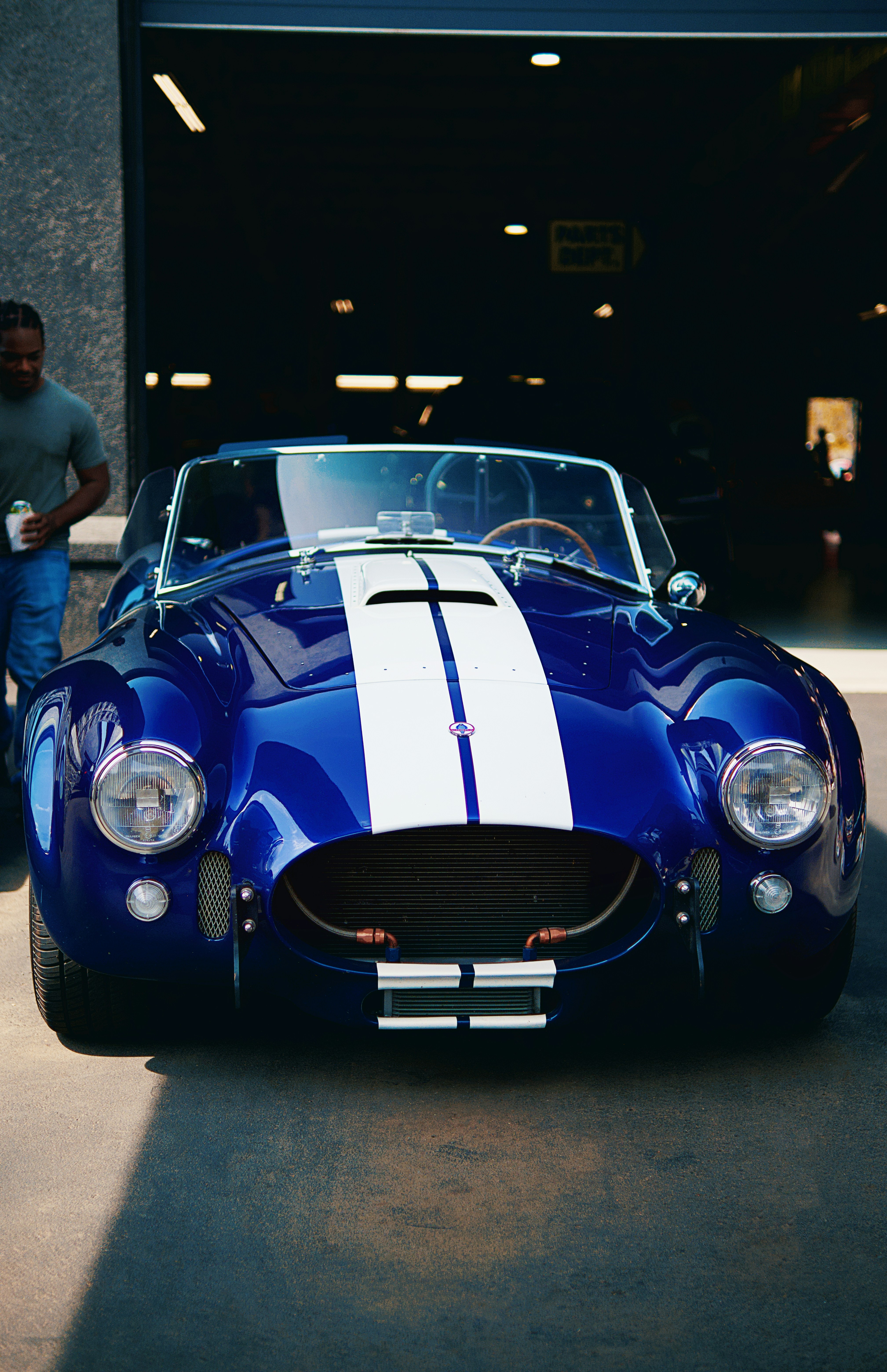 A blue and white classic car is parked. photo – Free Car Image on Unsplash
