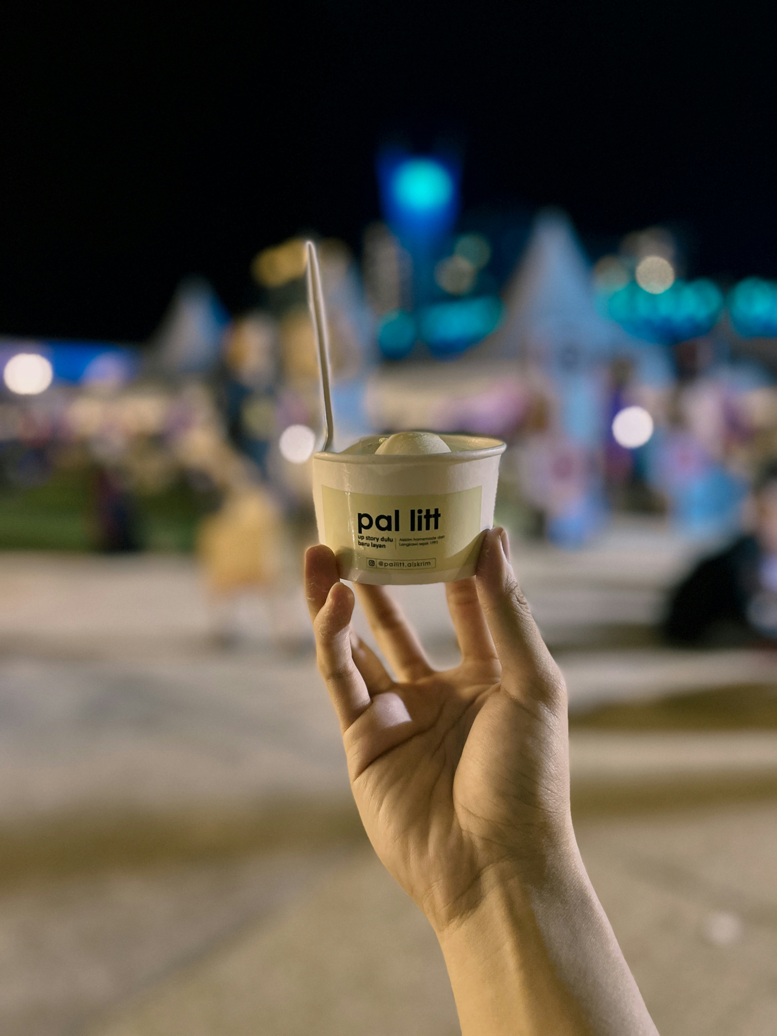 Cup in Focus: A Night Market Handheld Moment