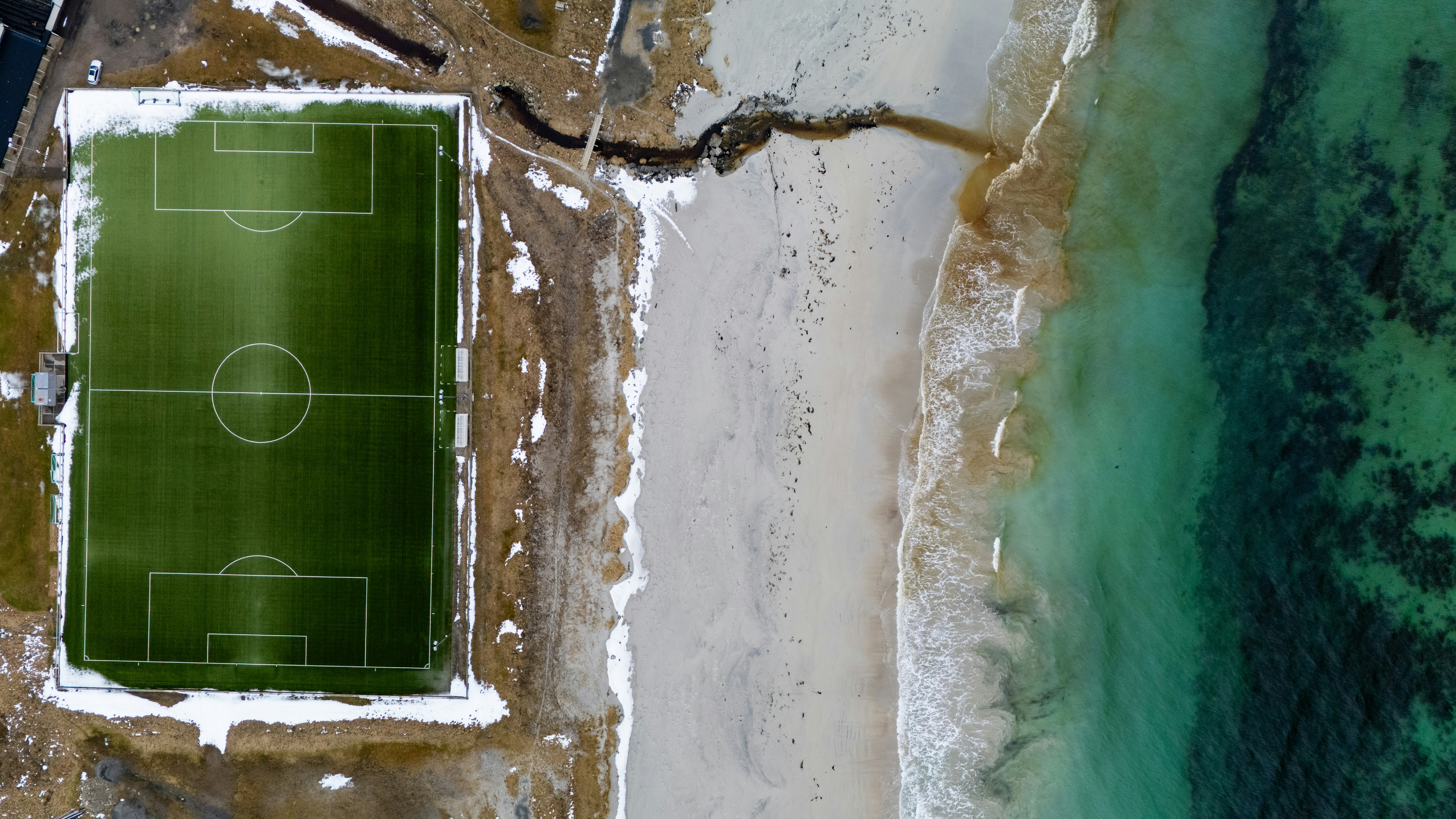 Snow-Kissed Pitch at the Edge of a Turquoise Coast