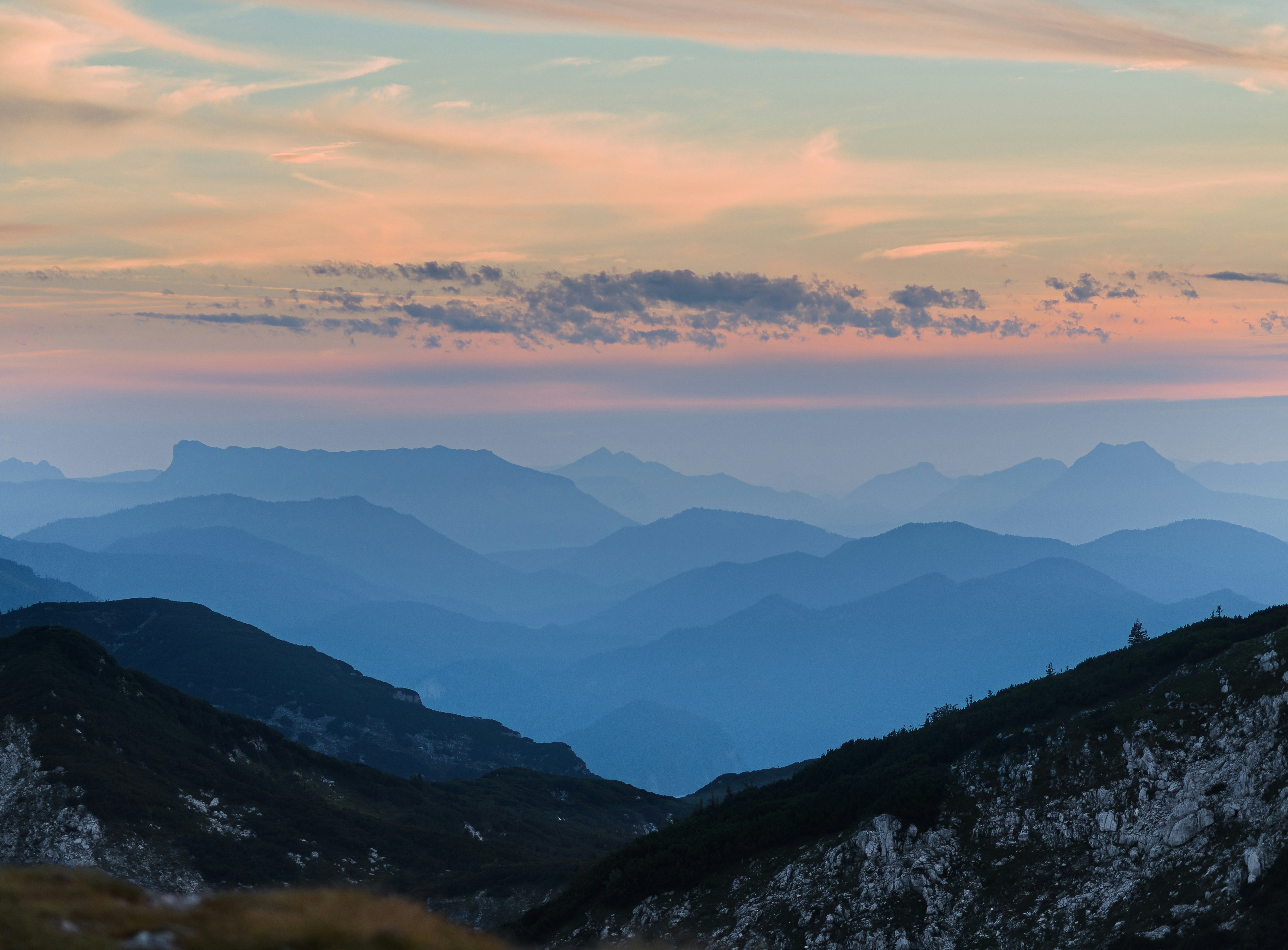 Mountains fade into the distance under a colorful sky. photo – Free ...