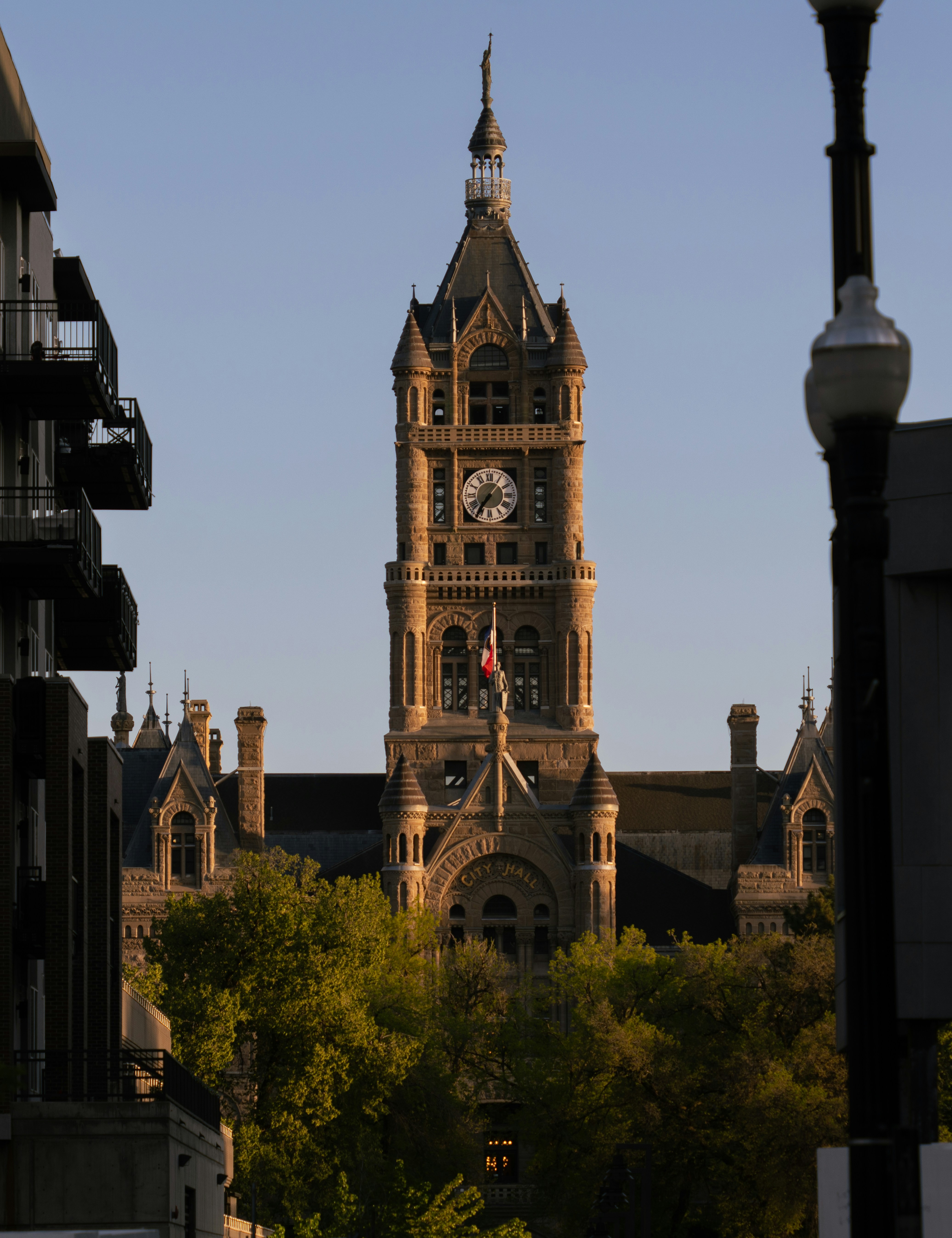 The clock tower building stands tall and ornate. photo – Free City ...