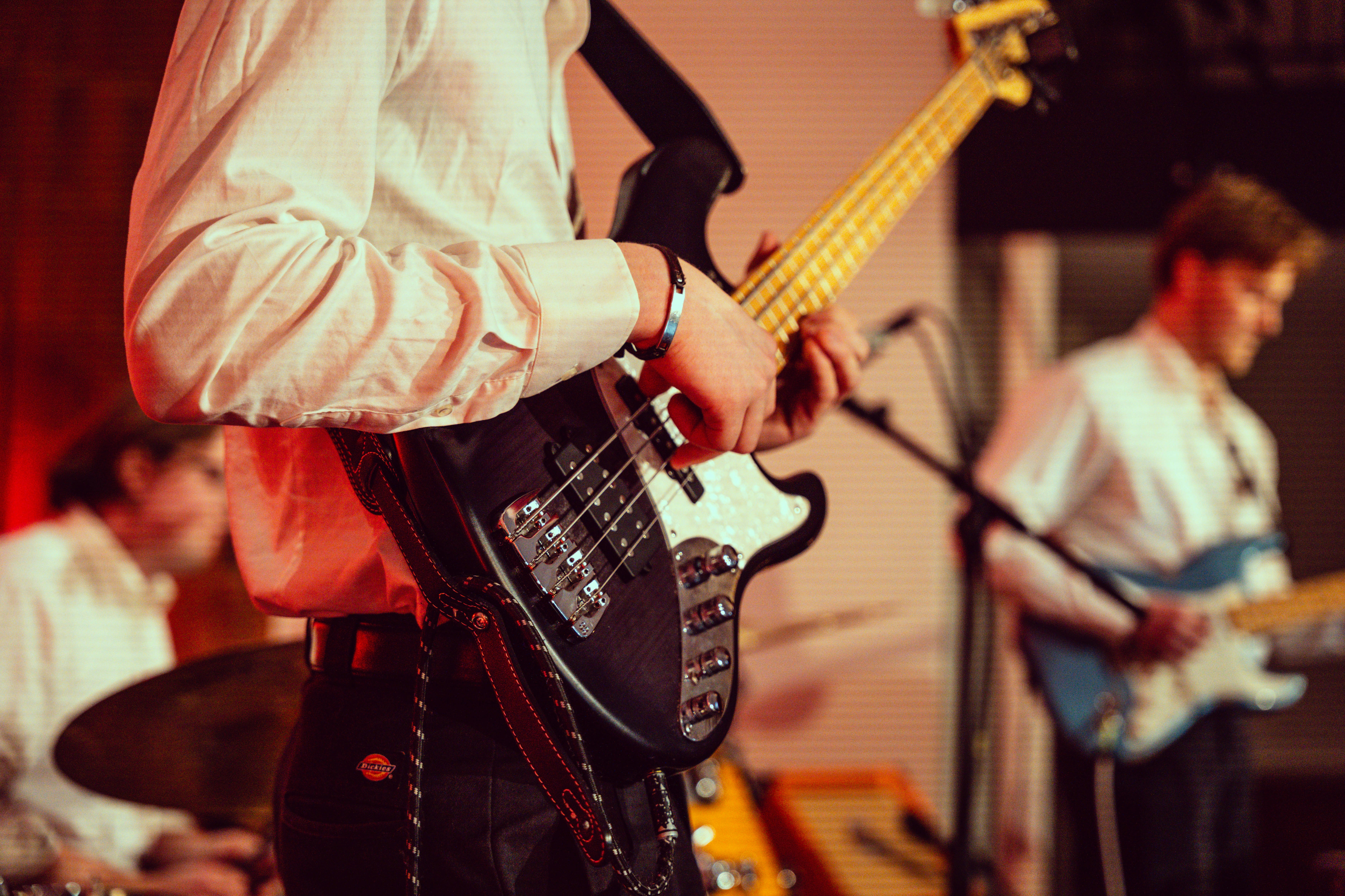 Band members performing live on stage.