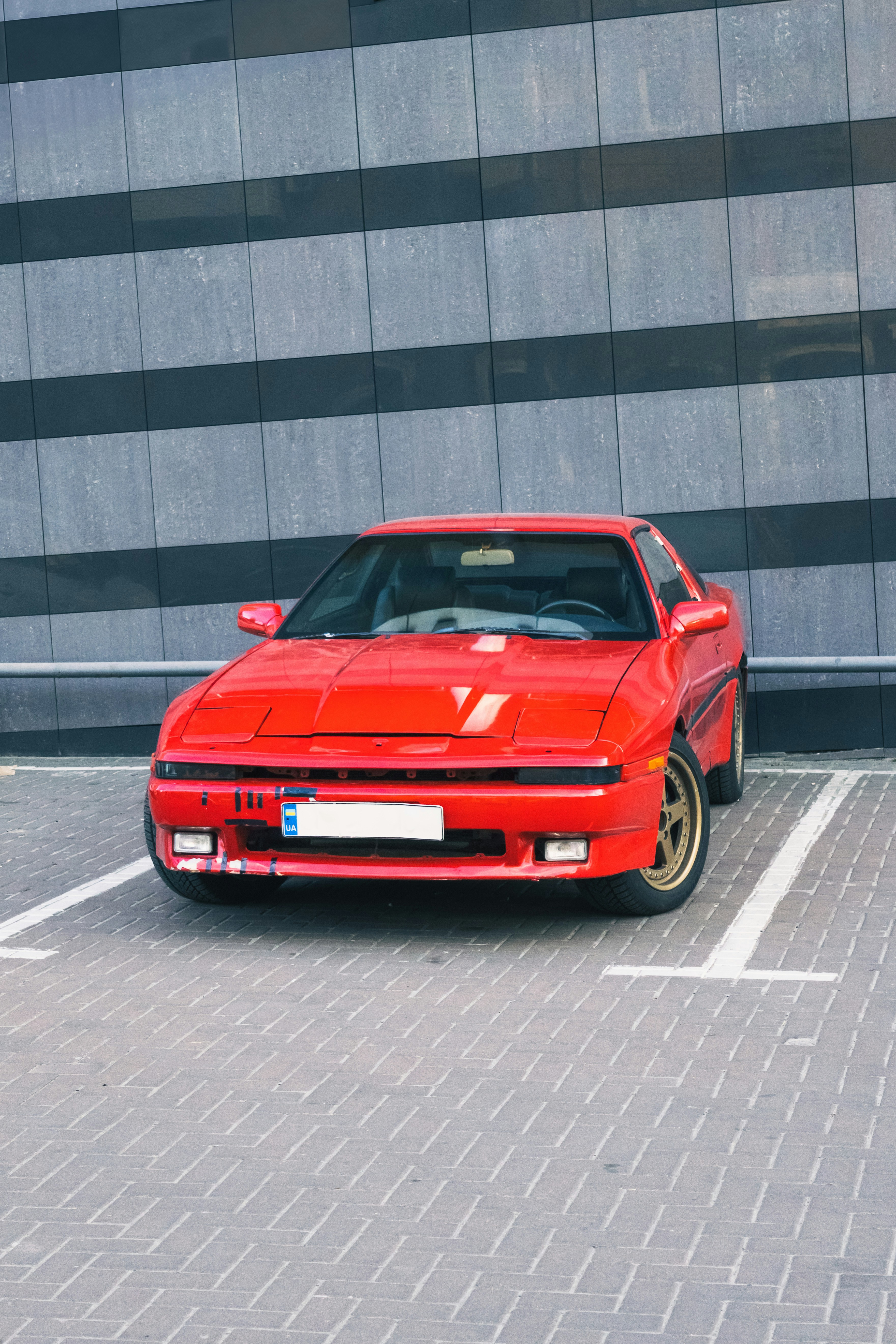 Red Dominance: A Classic Sports Coupe in Urban Matte